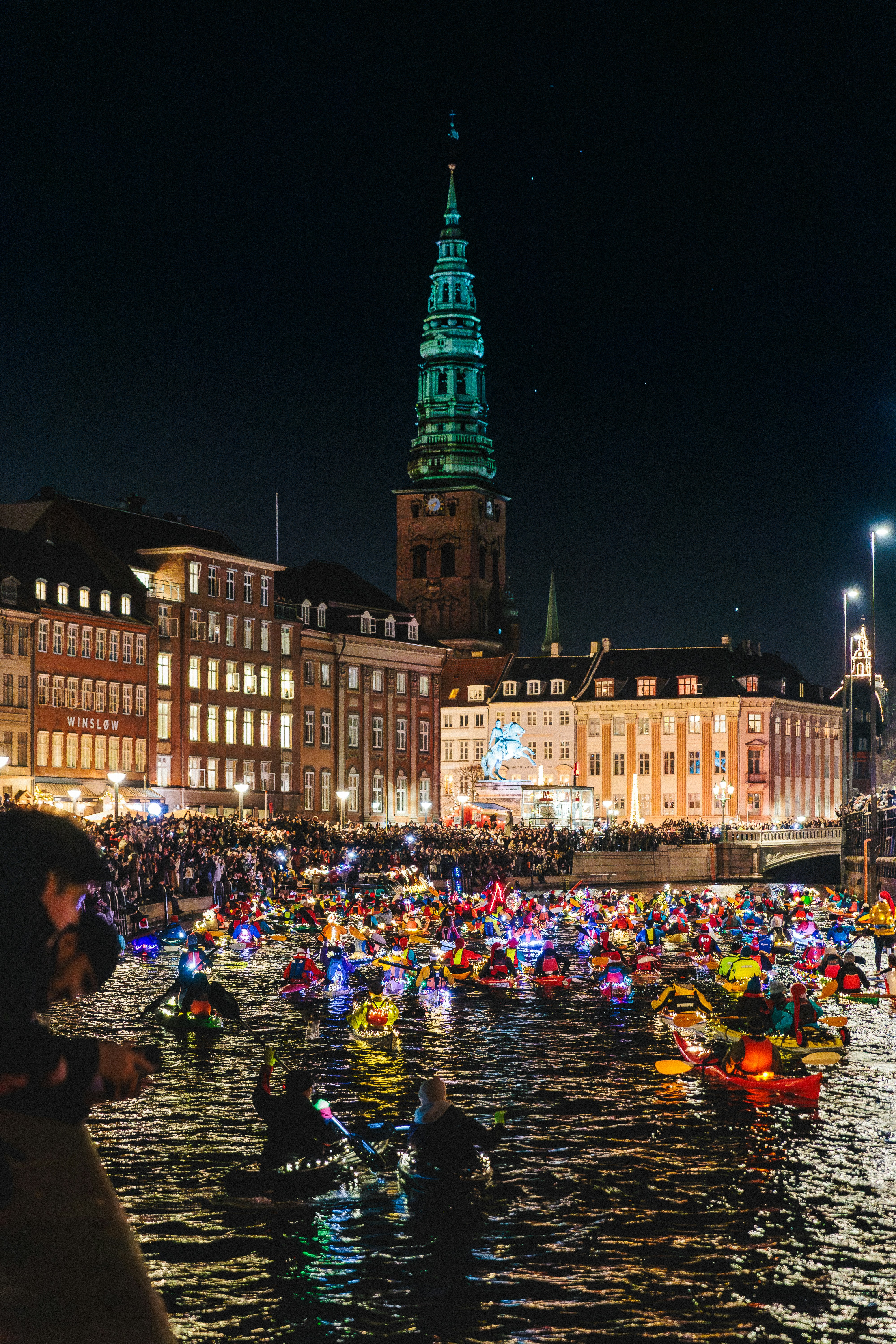 Moonlit Nyhavn: City Lights, Kayaks, and the Tower