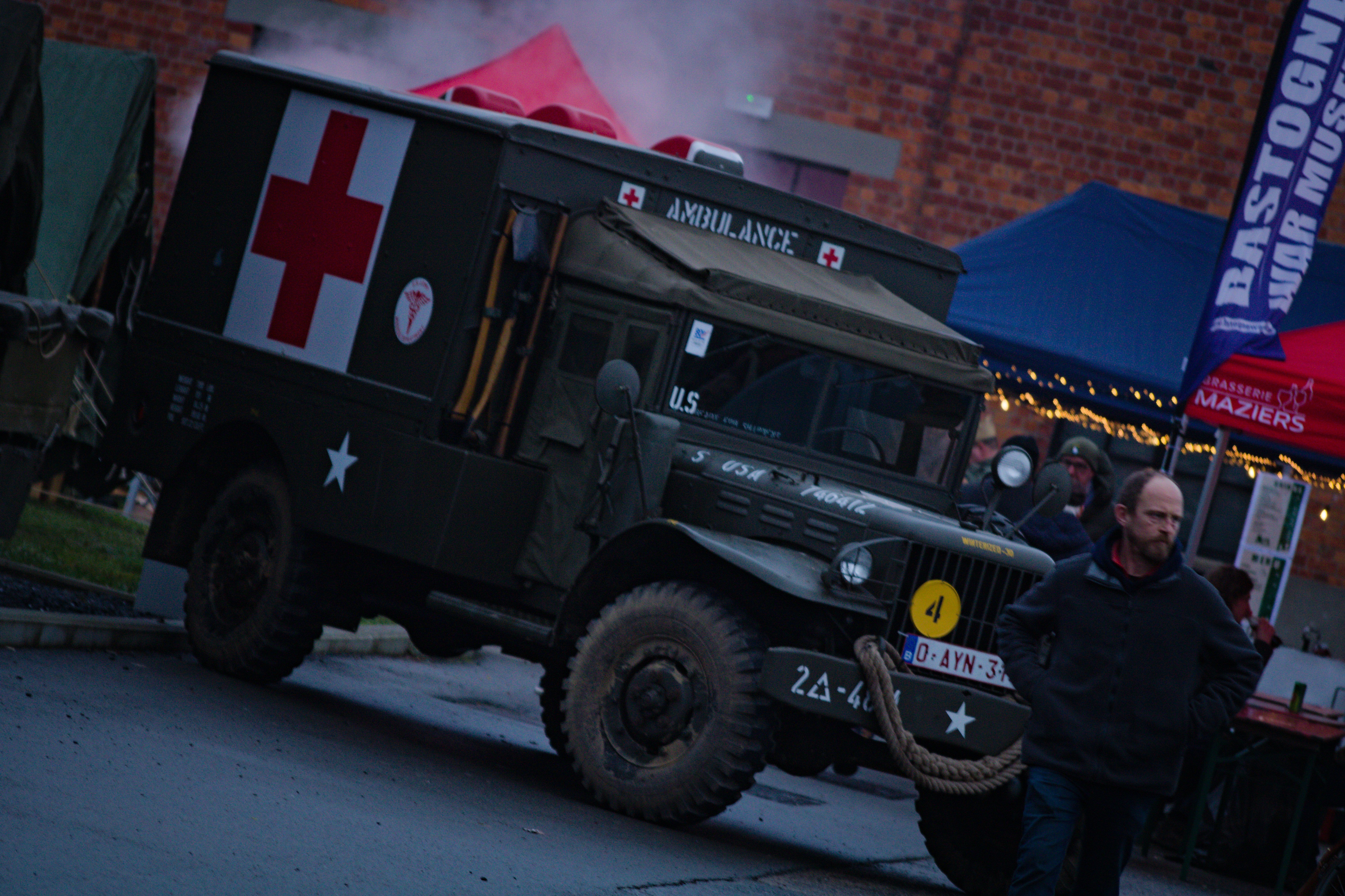 Ambulance and WWII-era Jeep Resting by the Event Tent