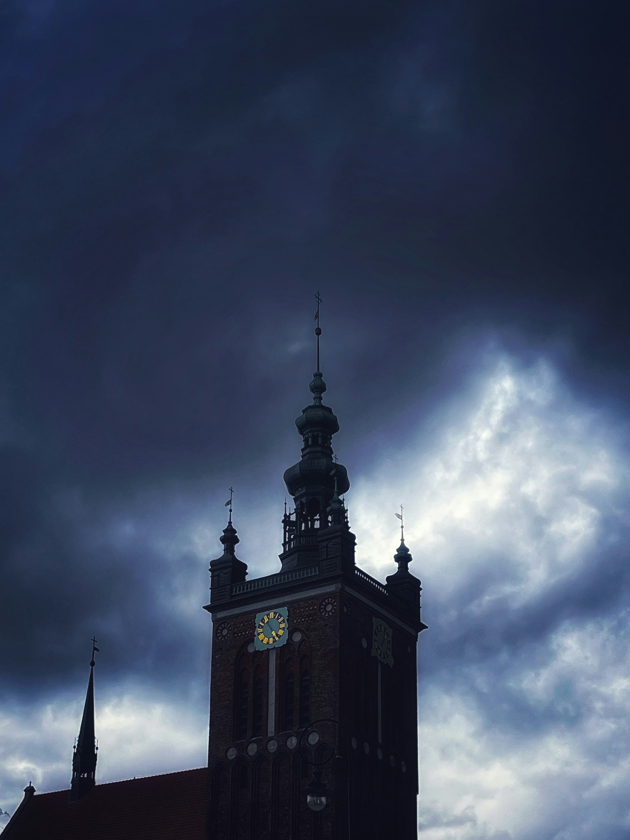 Towering Clock Tower Beneath a Looming Sky
