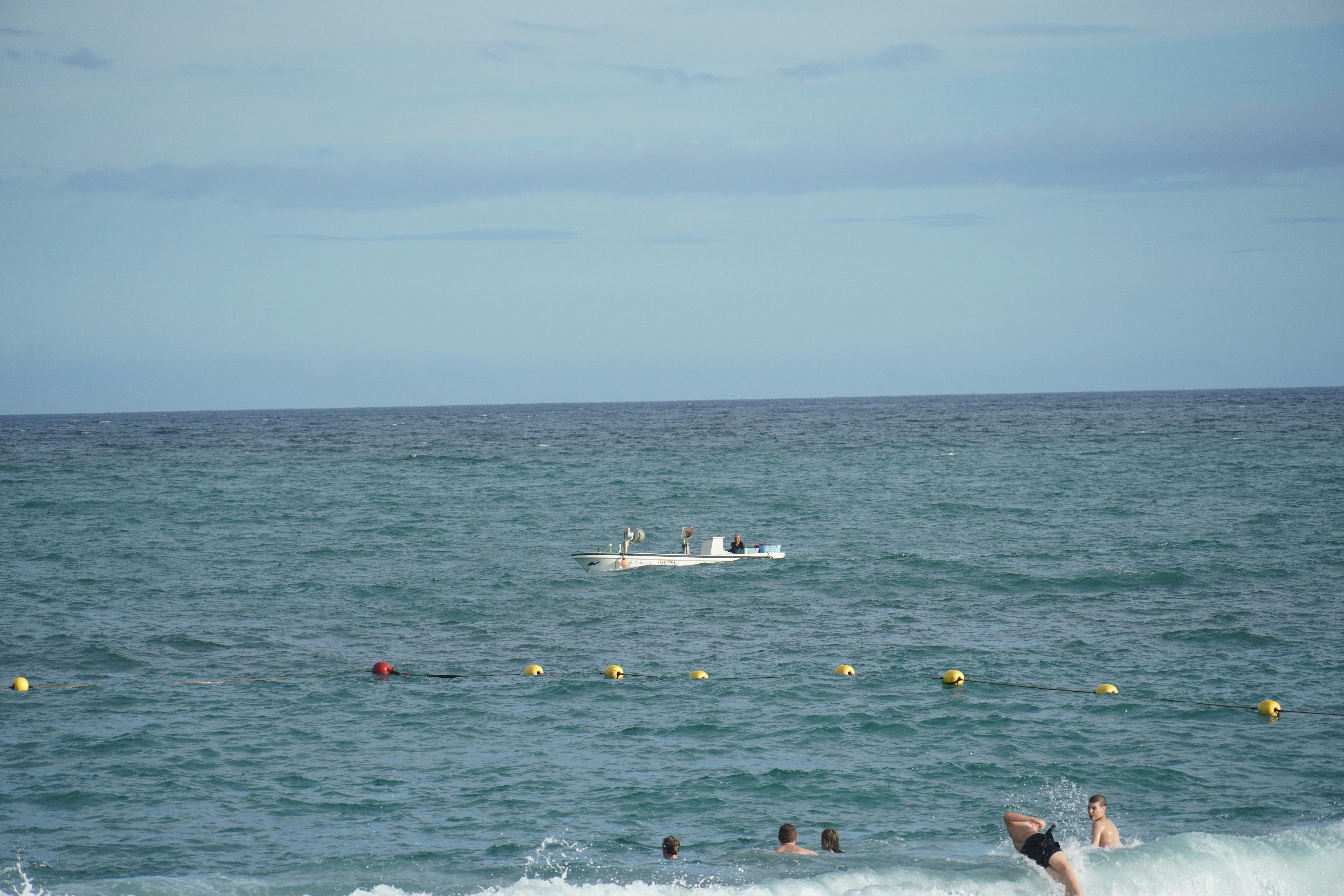 Life on the Line: Riders and Splash at a Calm Seaside