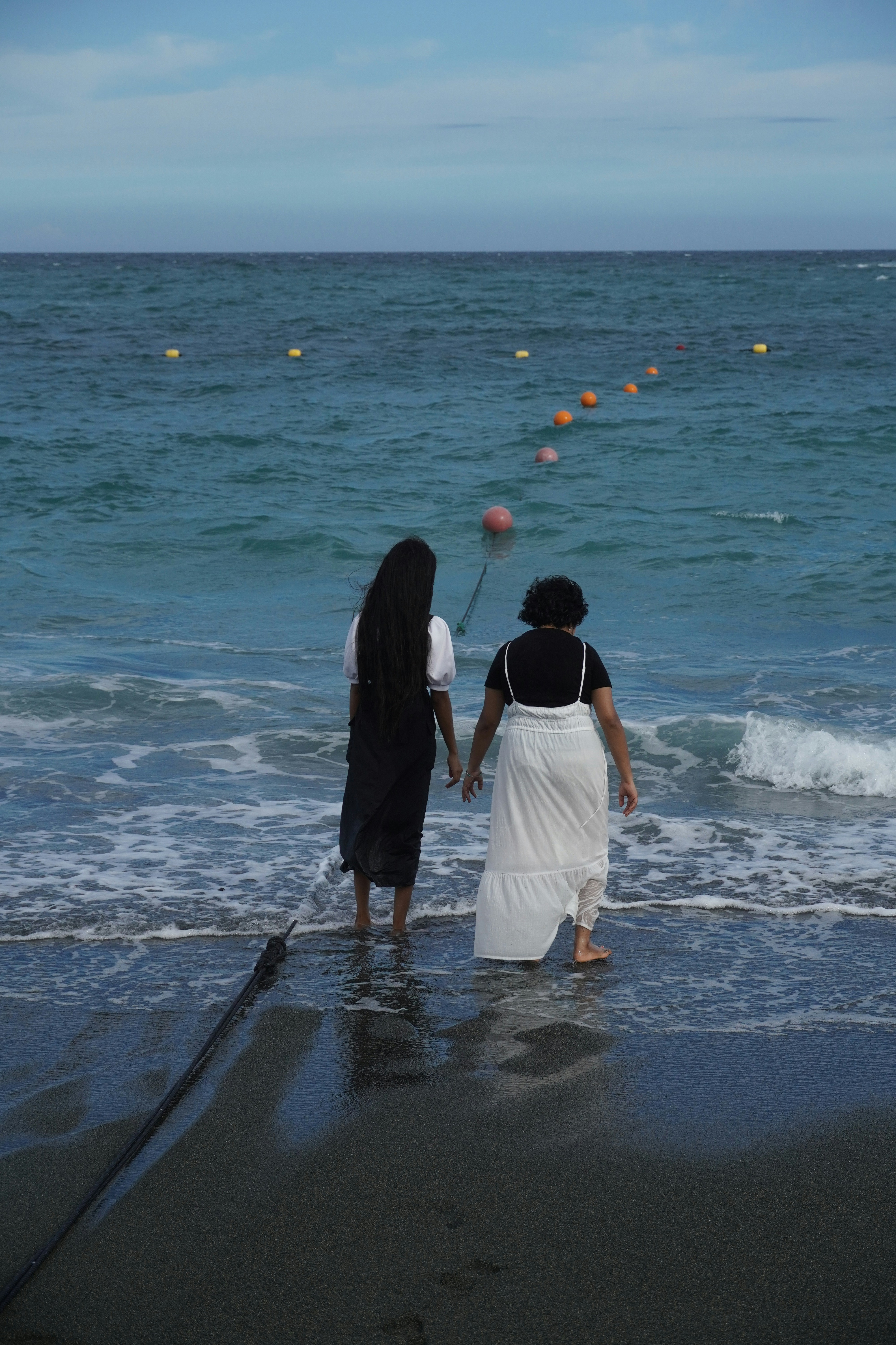 Gentle Shores: A Moment Shared at the Tidal Edge