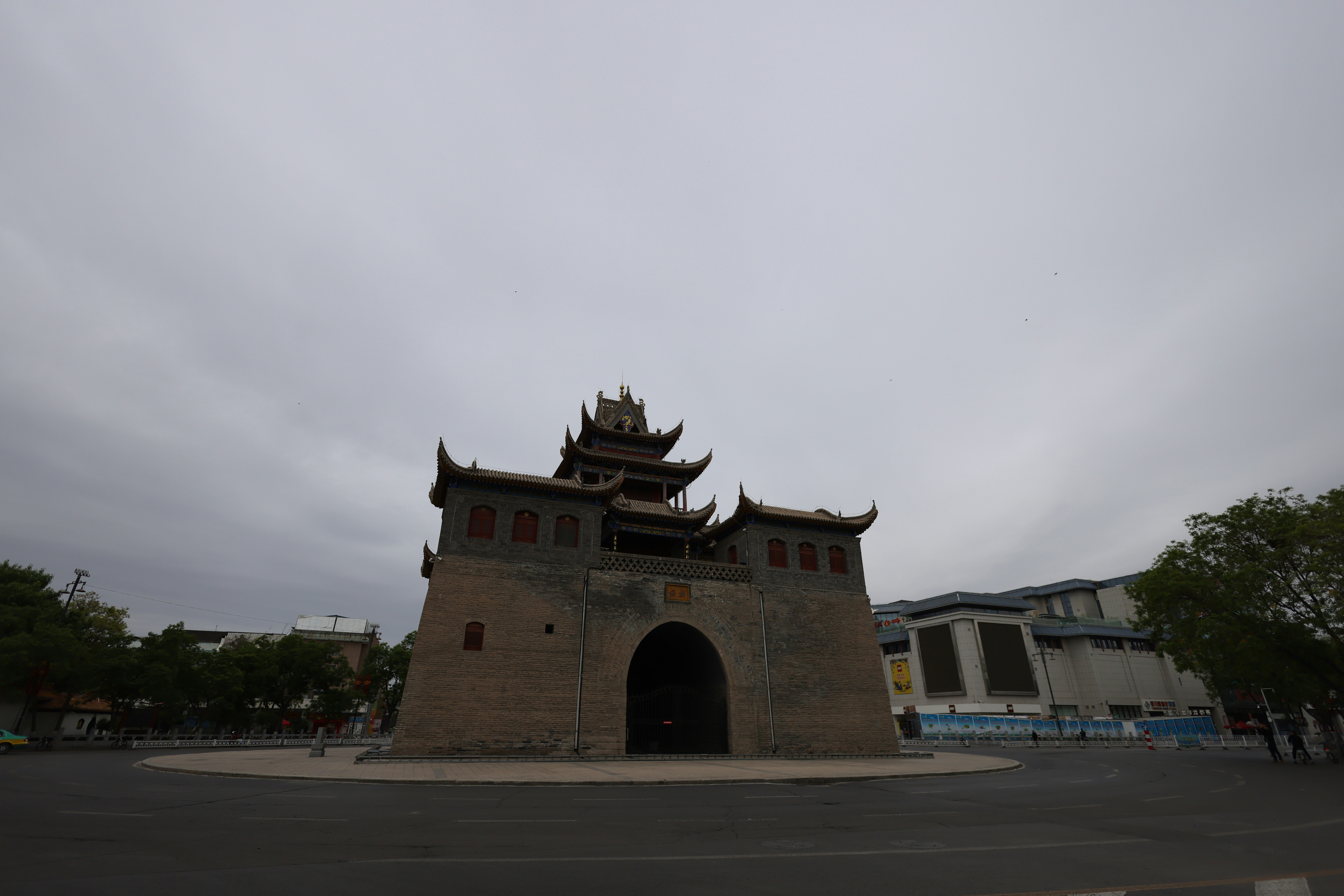 Gateway to the City: A Historic Arch Under Overcast Skies