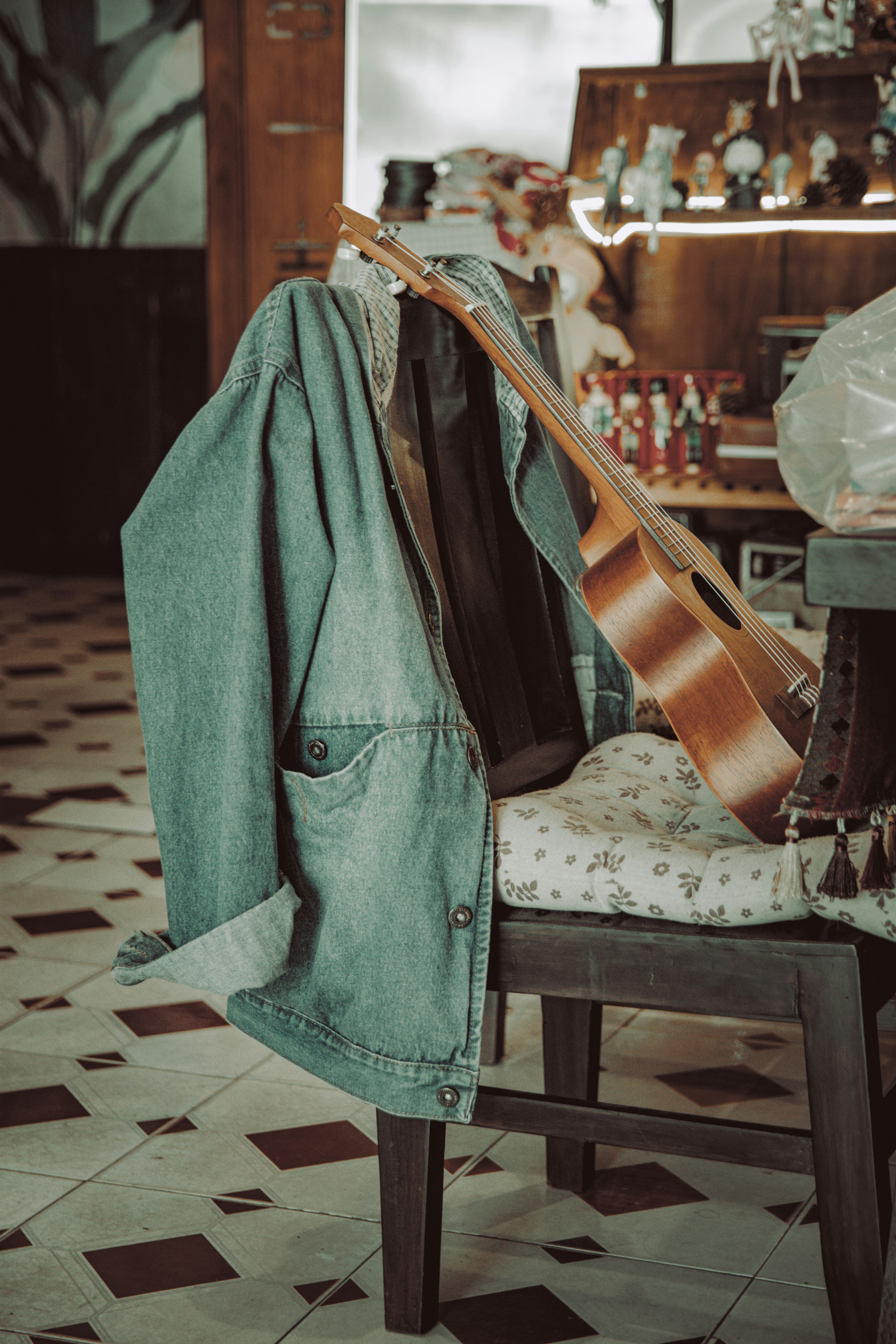 Dusty Guitar Resting on a Worn Chair in a Quiet Studio