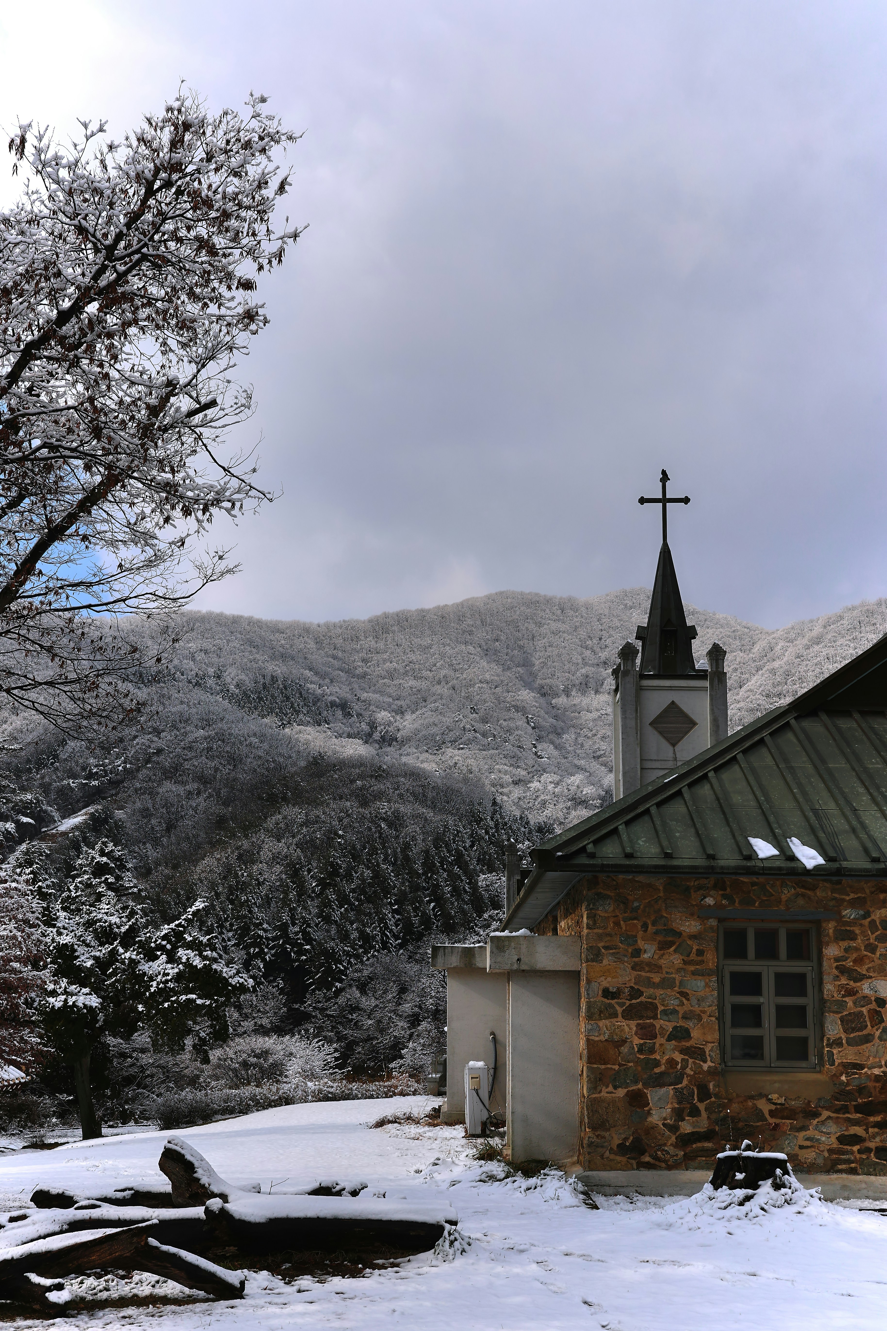 Snow-Capped Chapel Beneath a Winter Sky