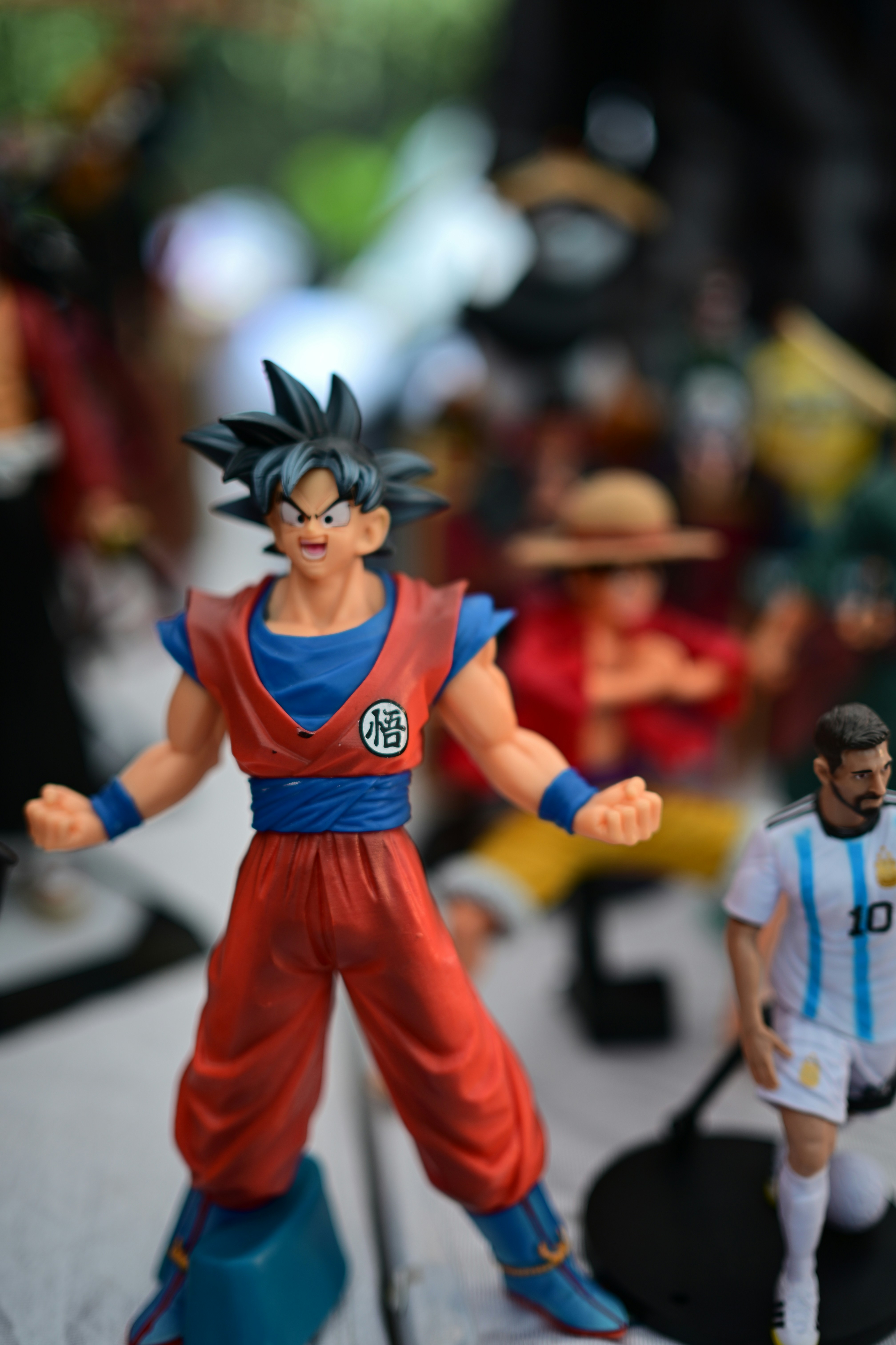 Goku Stance: Heroic Figure Surrounded by Dynamic Collectibles