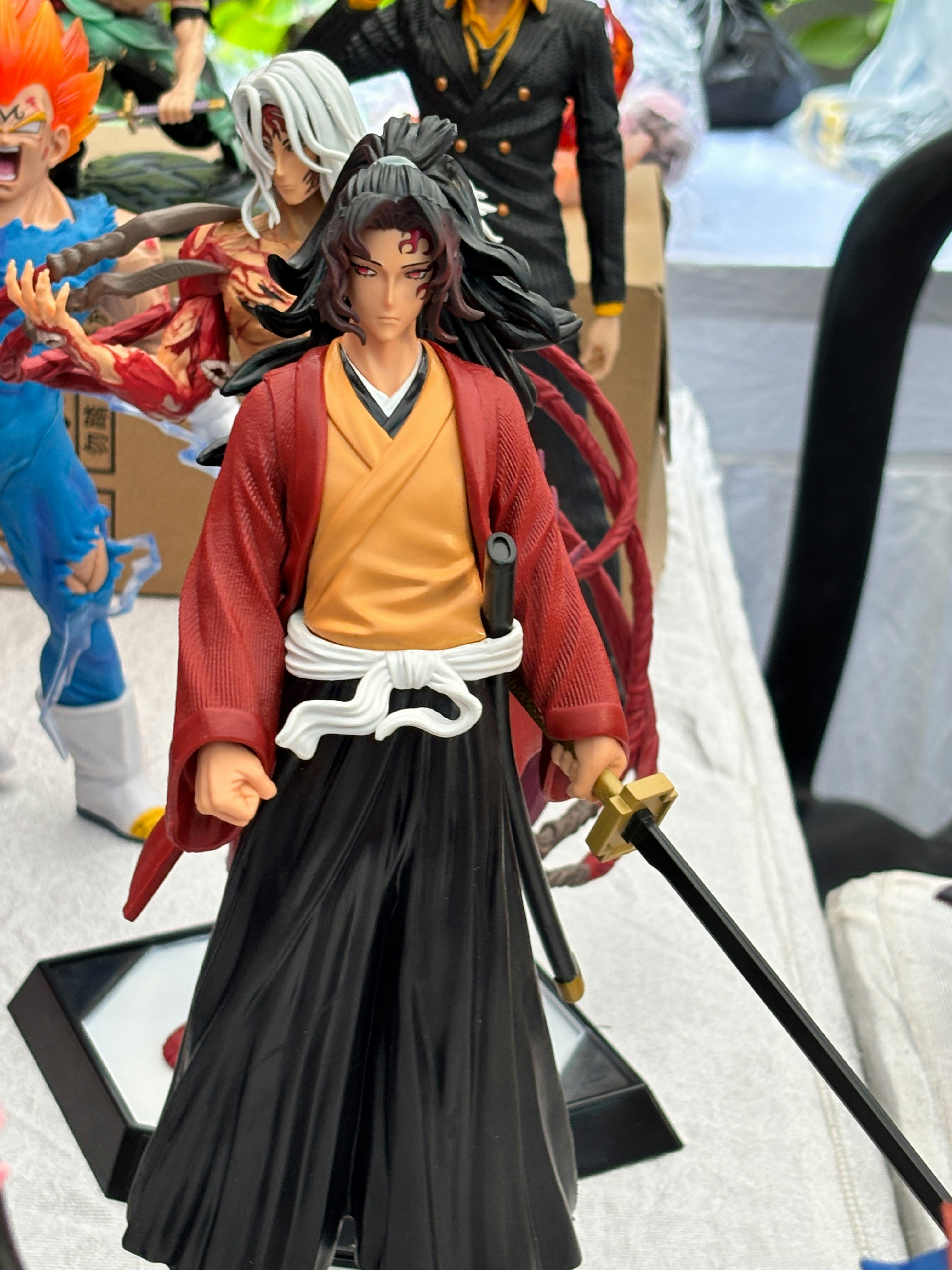 Samurai in Red: A Centered Figure Among Cosplay Ensemble