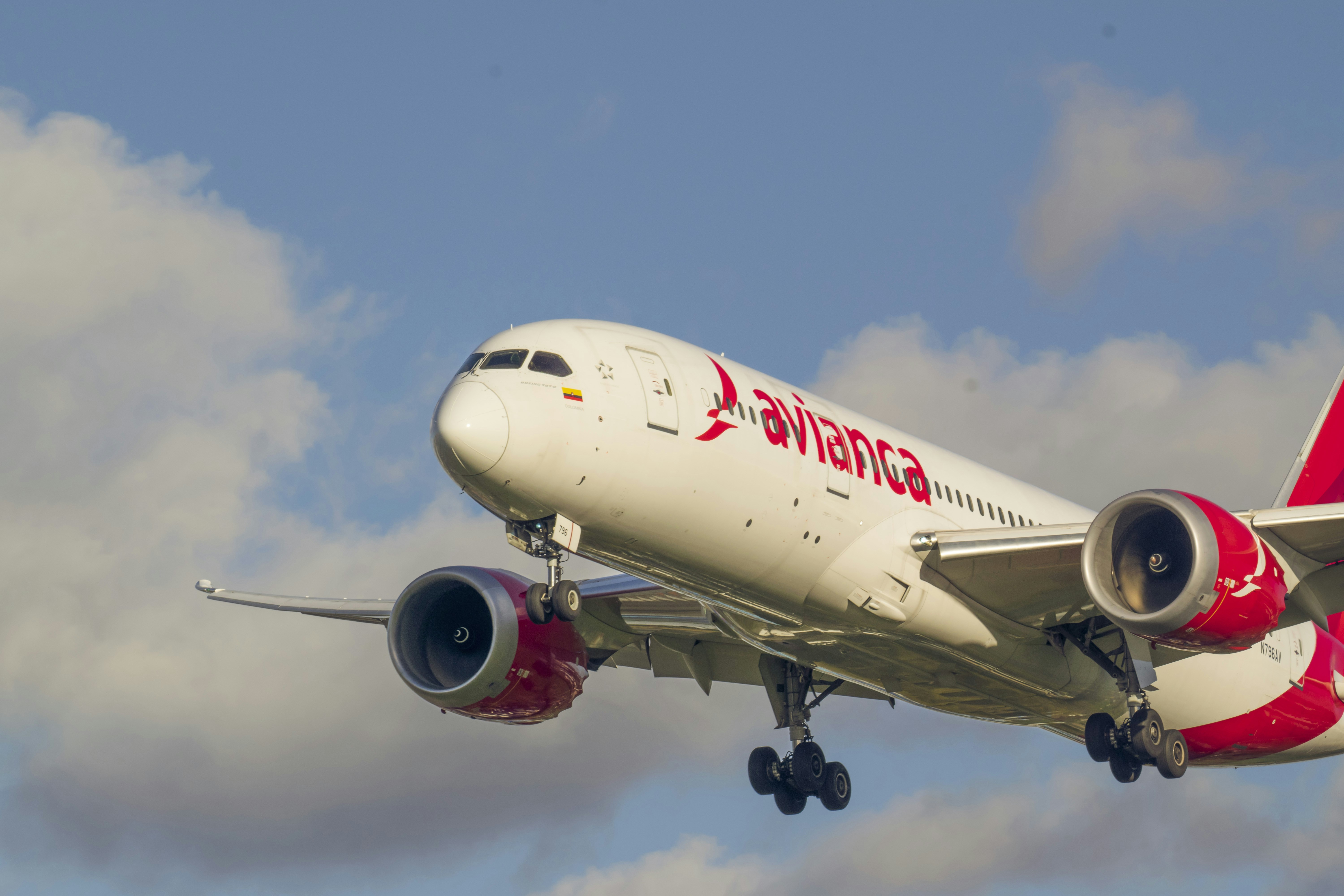 Airliner in ascent: Avianca slips through a blue sky