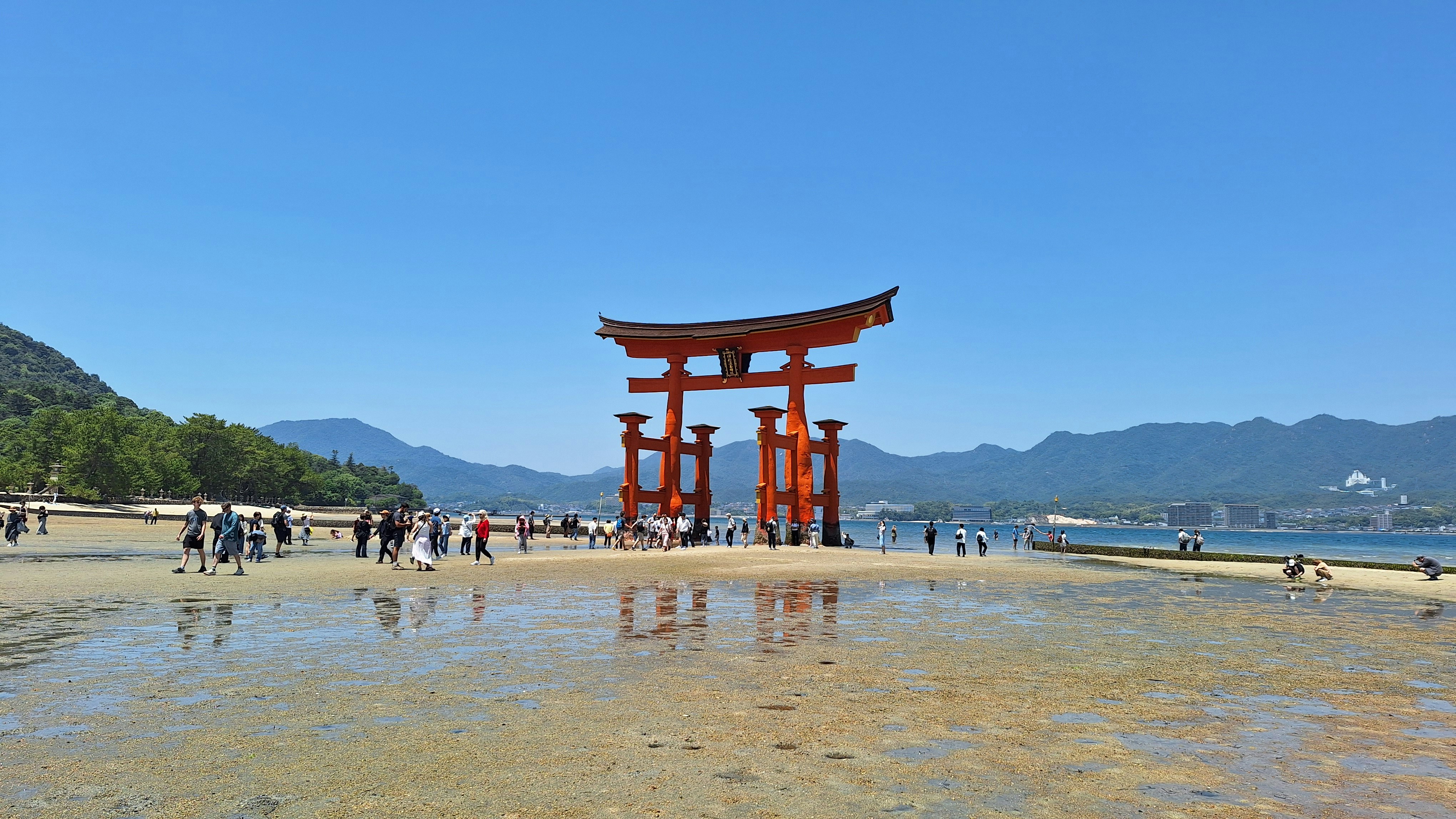 Red Torii on a Shimmering Coastal Cord: The Itsukushima-inspired Gate at Low Tide