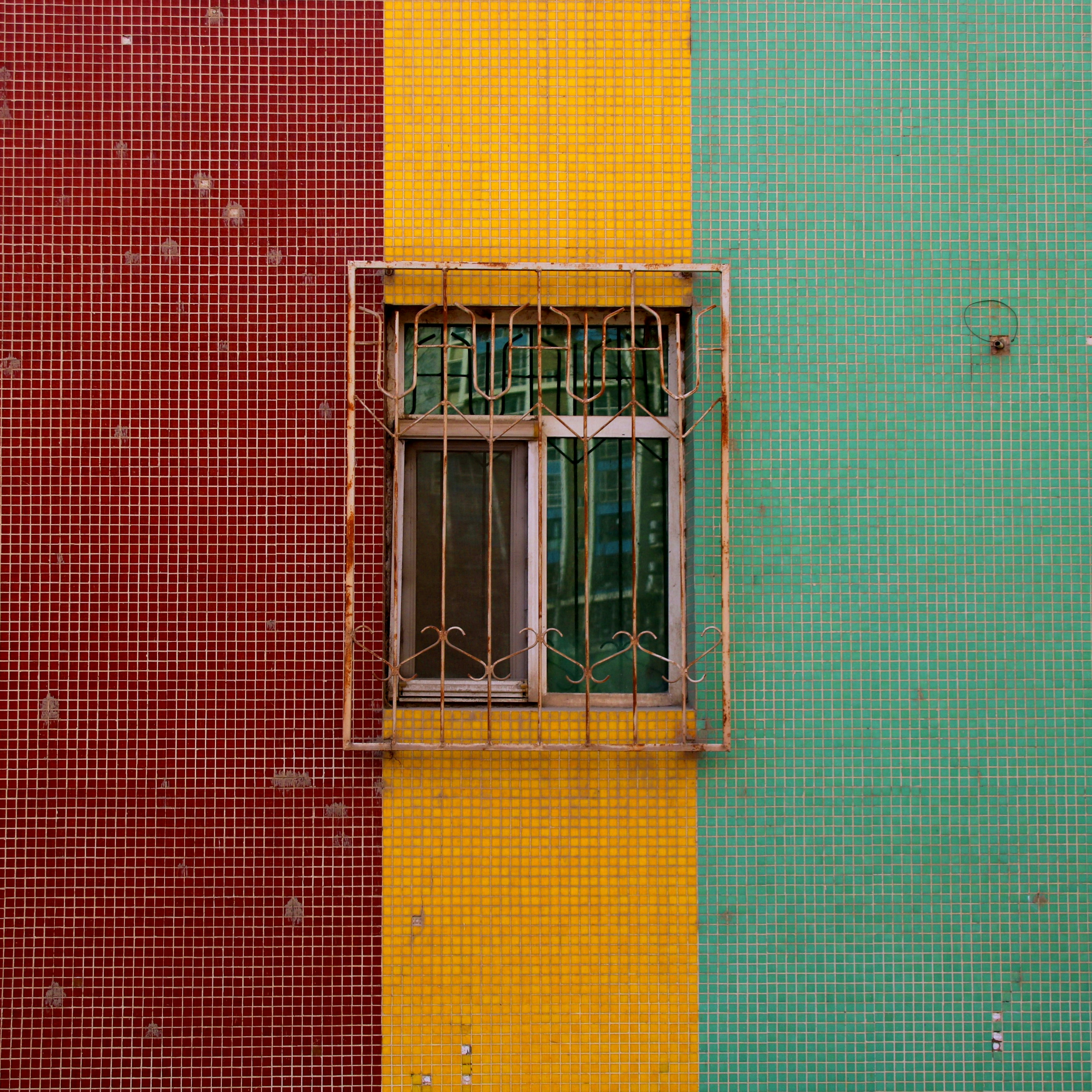 Color Blocks and Iron Grille over a Painted Window