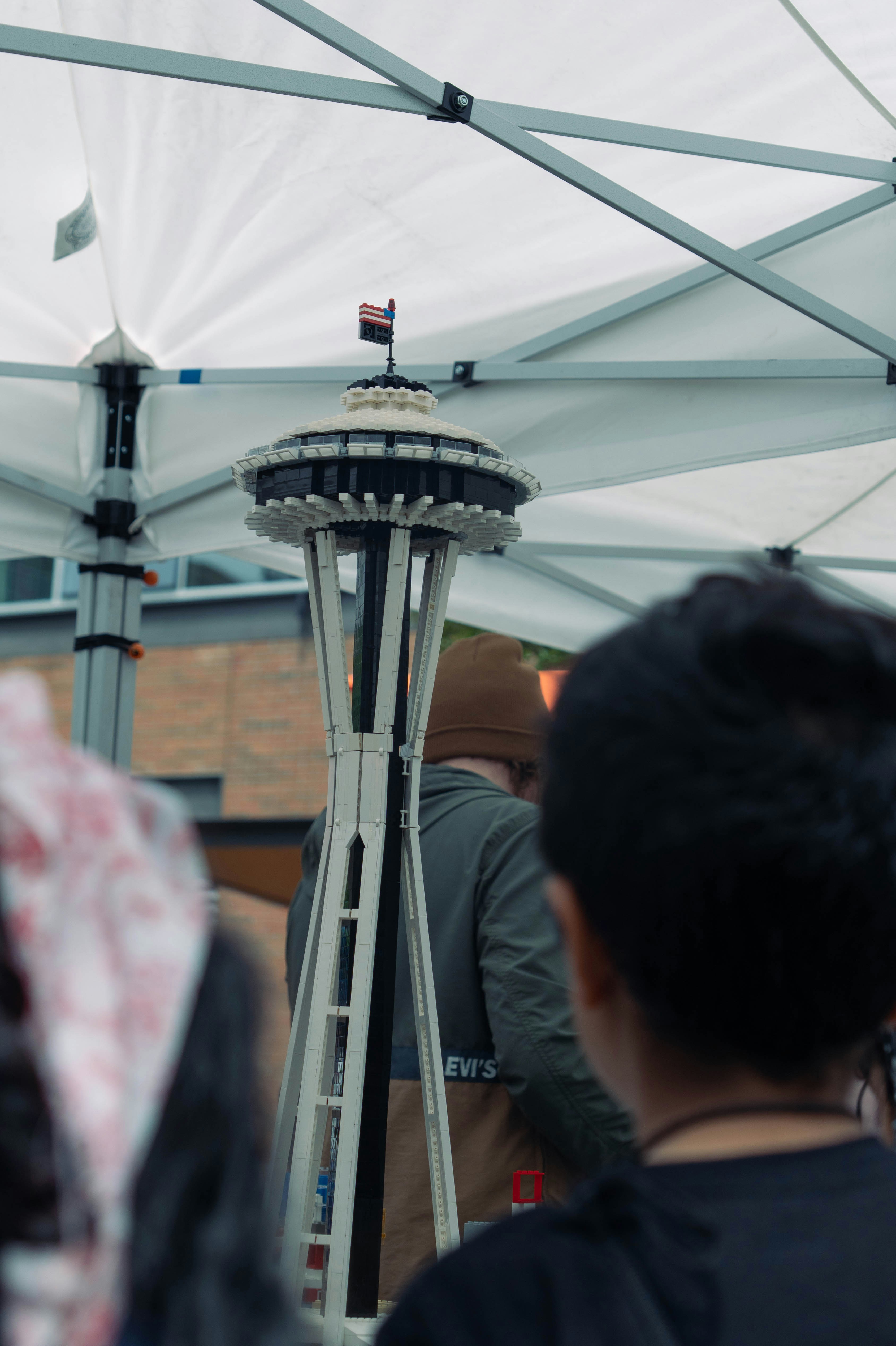 Towering Icon in a Tent of Voices