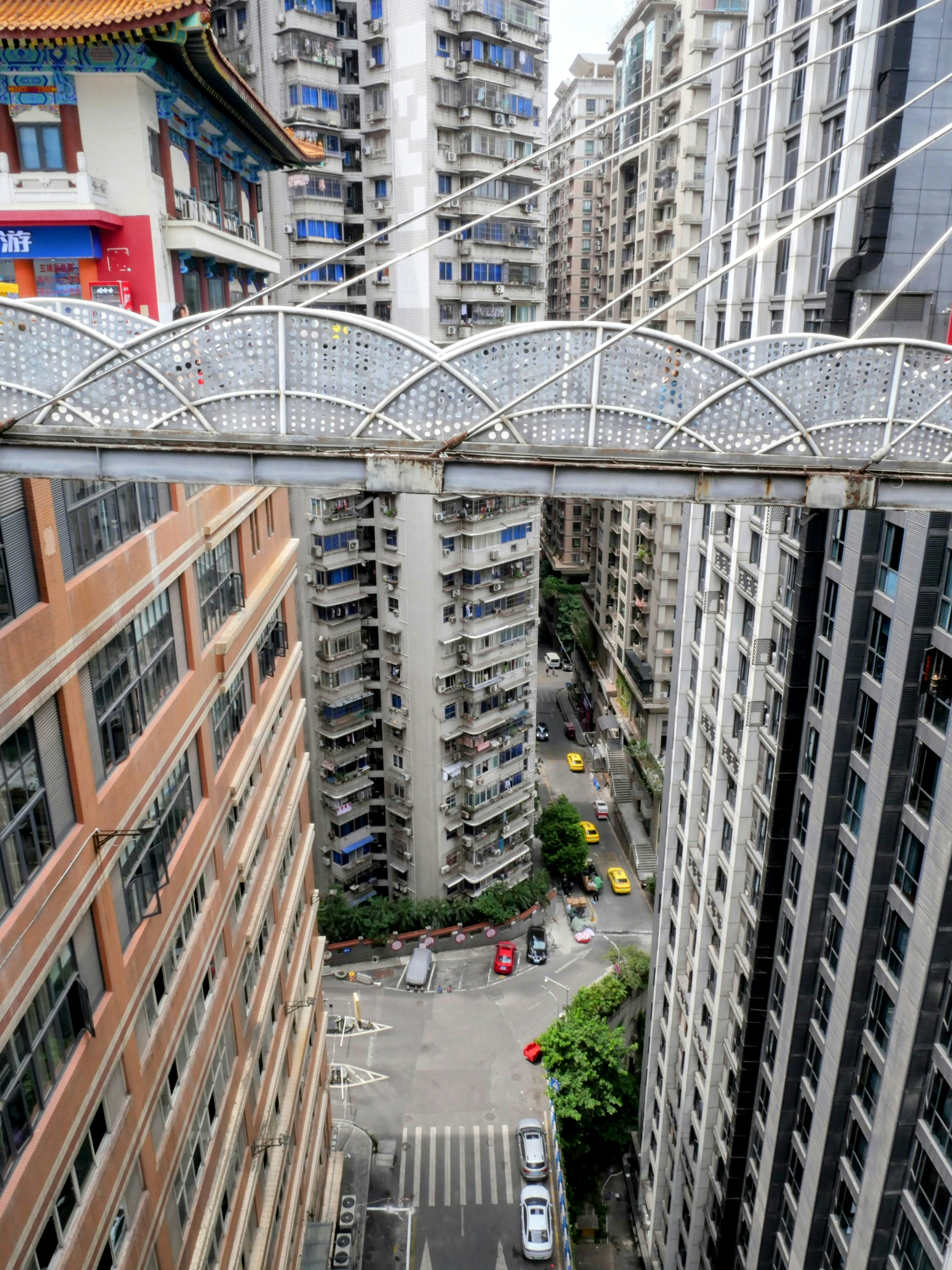 Urban Elevation: A Narrow Gorge of Towers and a Sky-Bridge