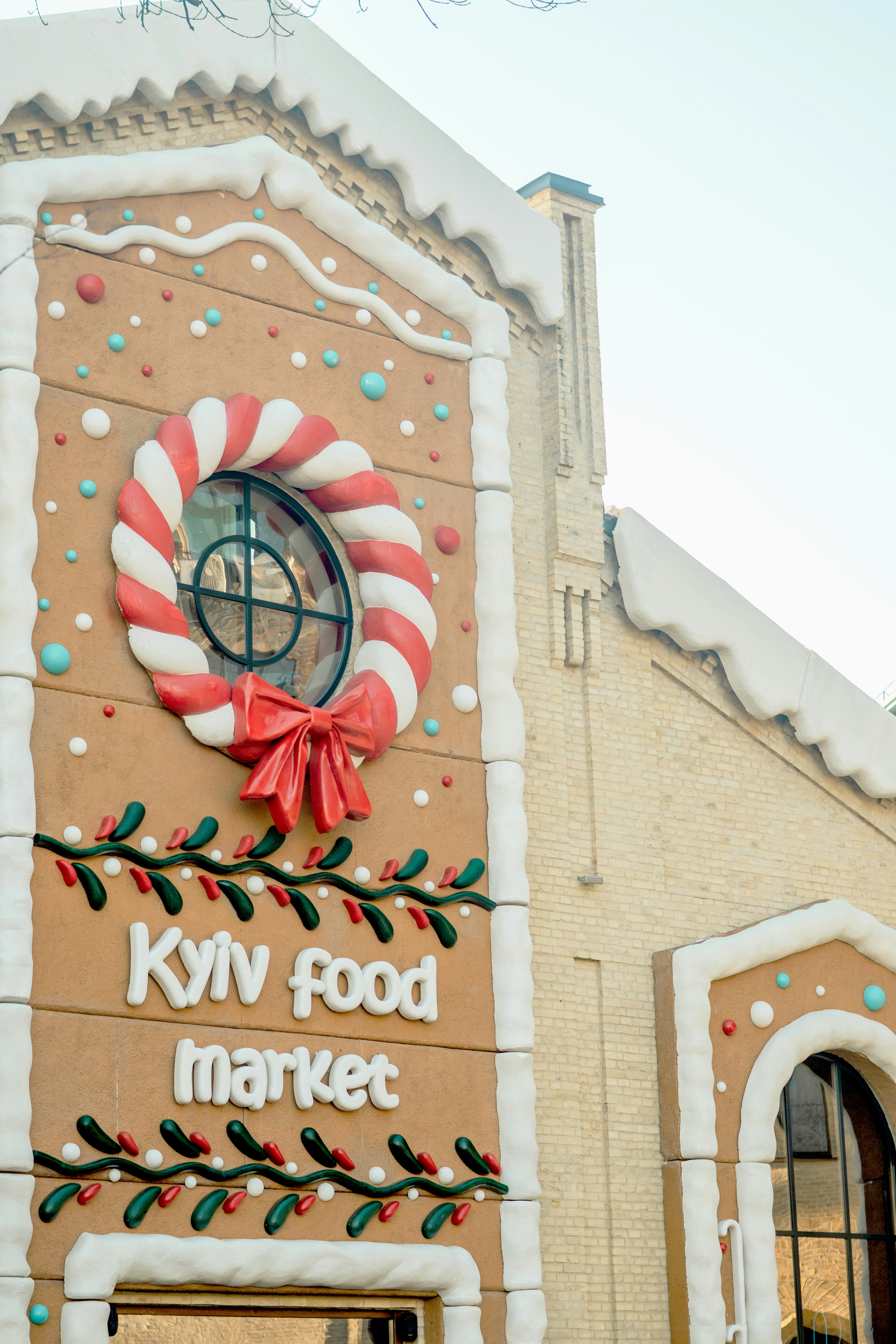 Gingerbread house facade with "kyiv food market" text. photo – Free ...