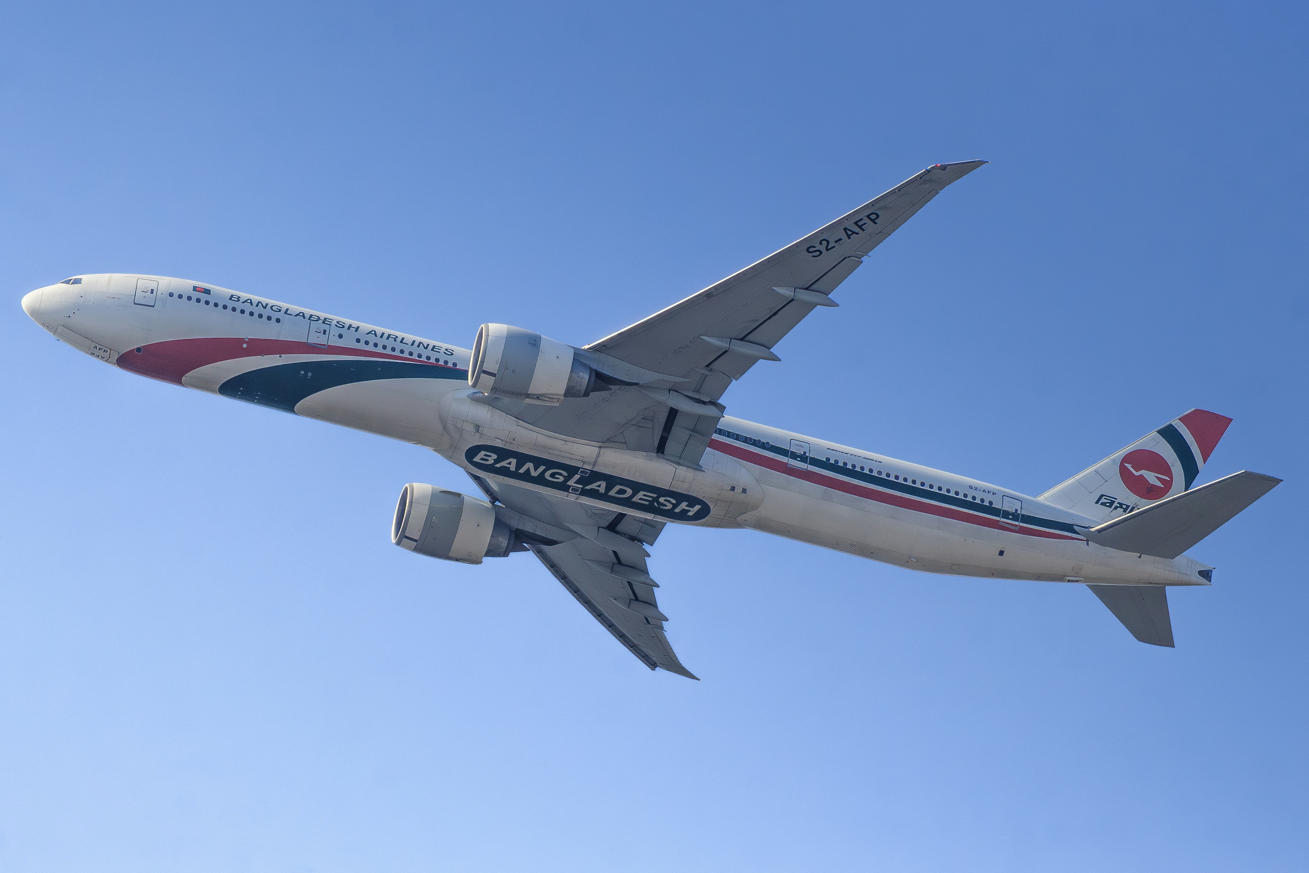 Bangladesh Airlines in a Clear Sky Passes Over The Frame