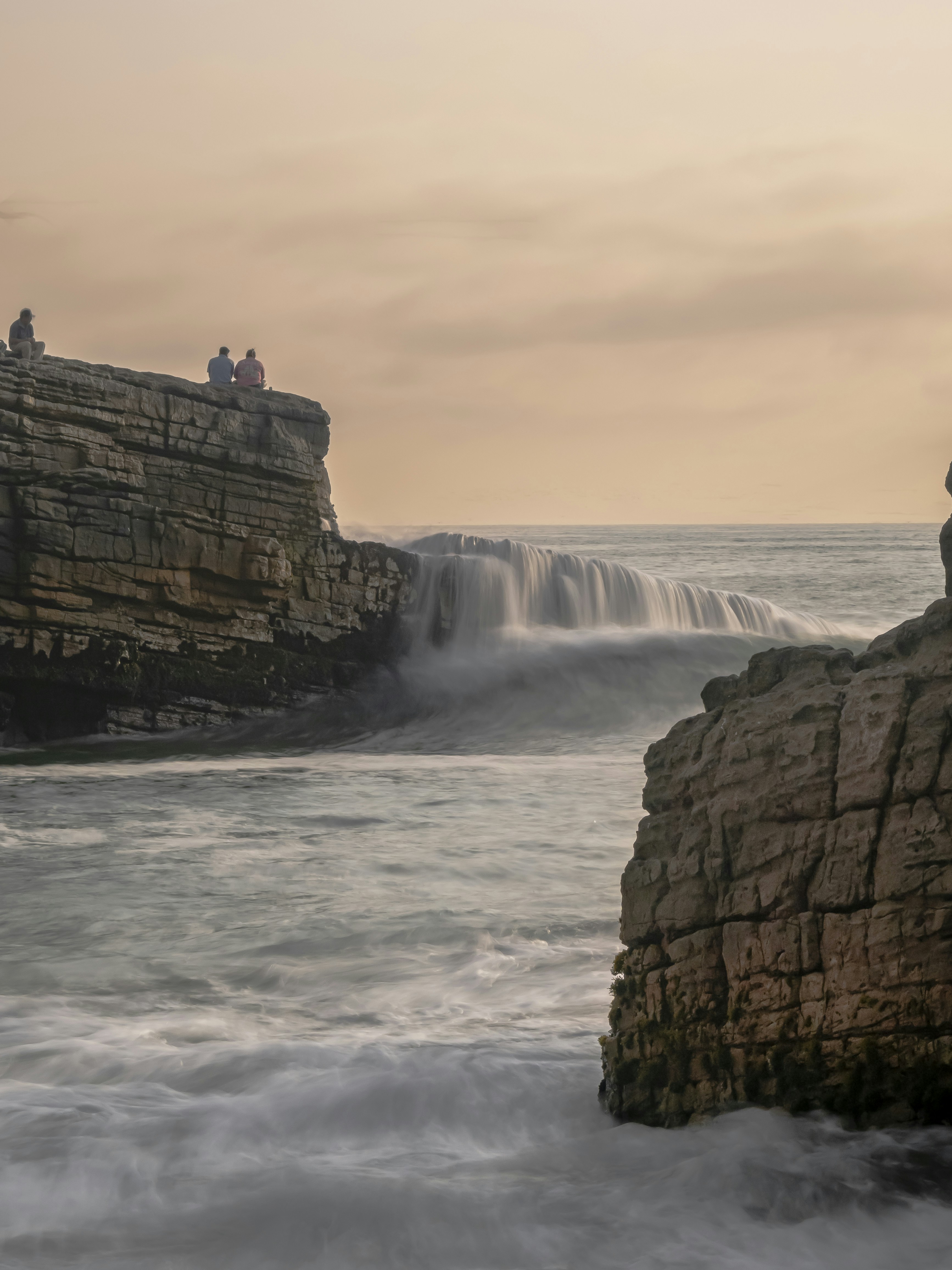 Sunset Over the Rime-Lined Cliffs and Plunging Water