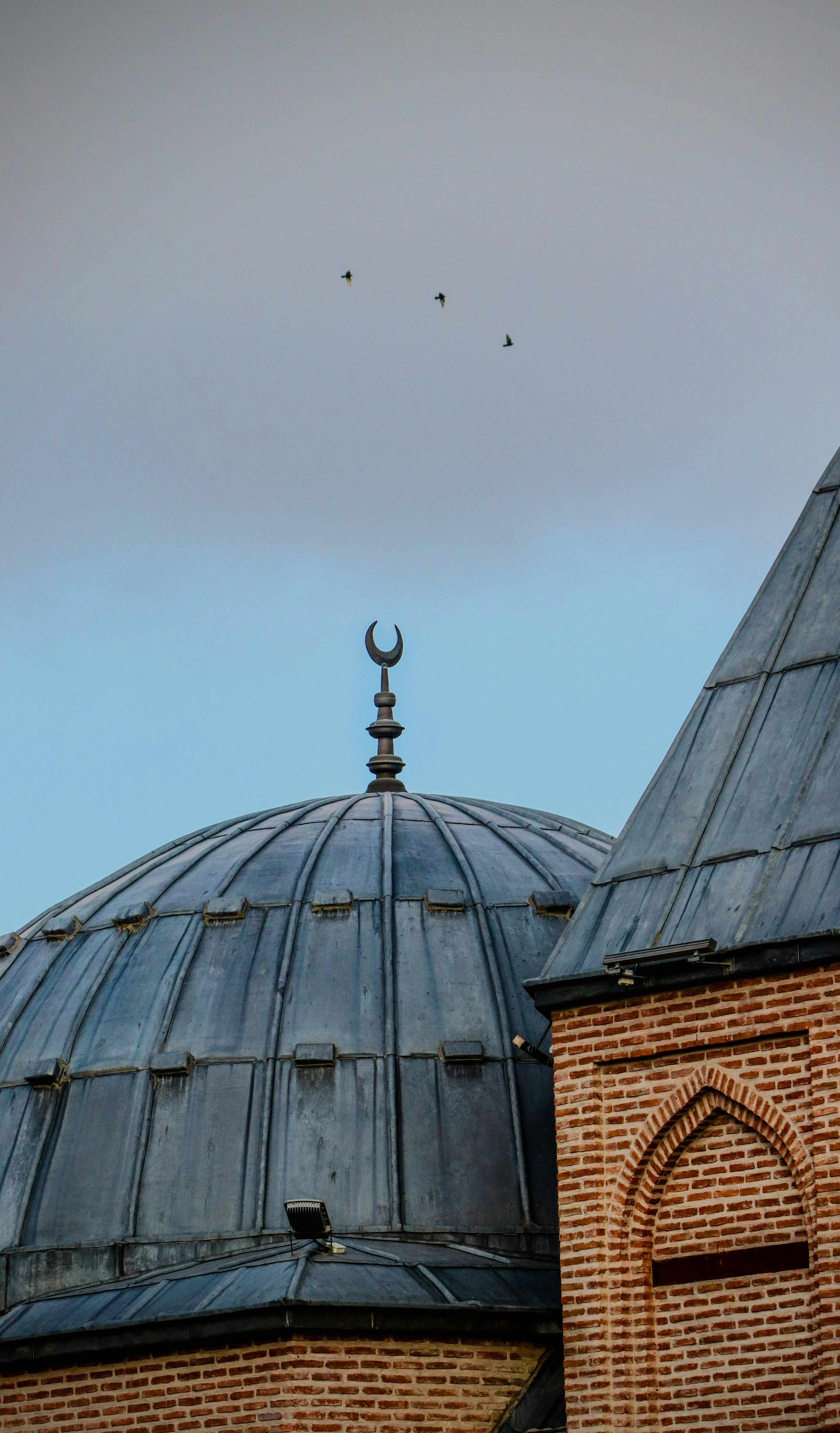 Moonlit Dome: A Mosque’s Silhouette Against a Quiet Sky