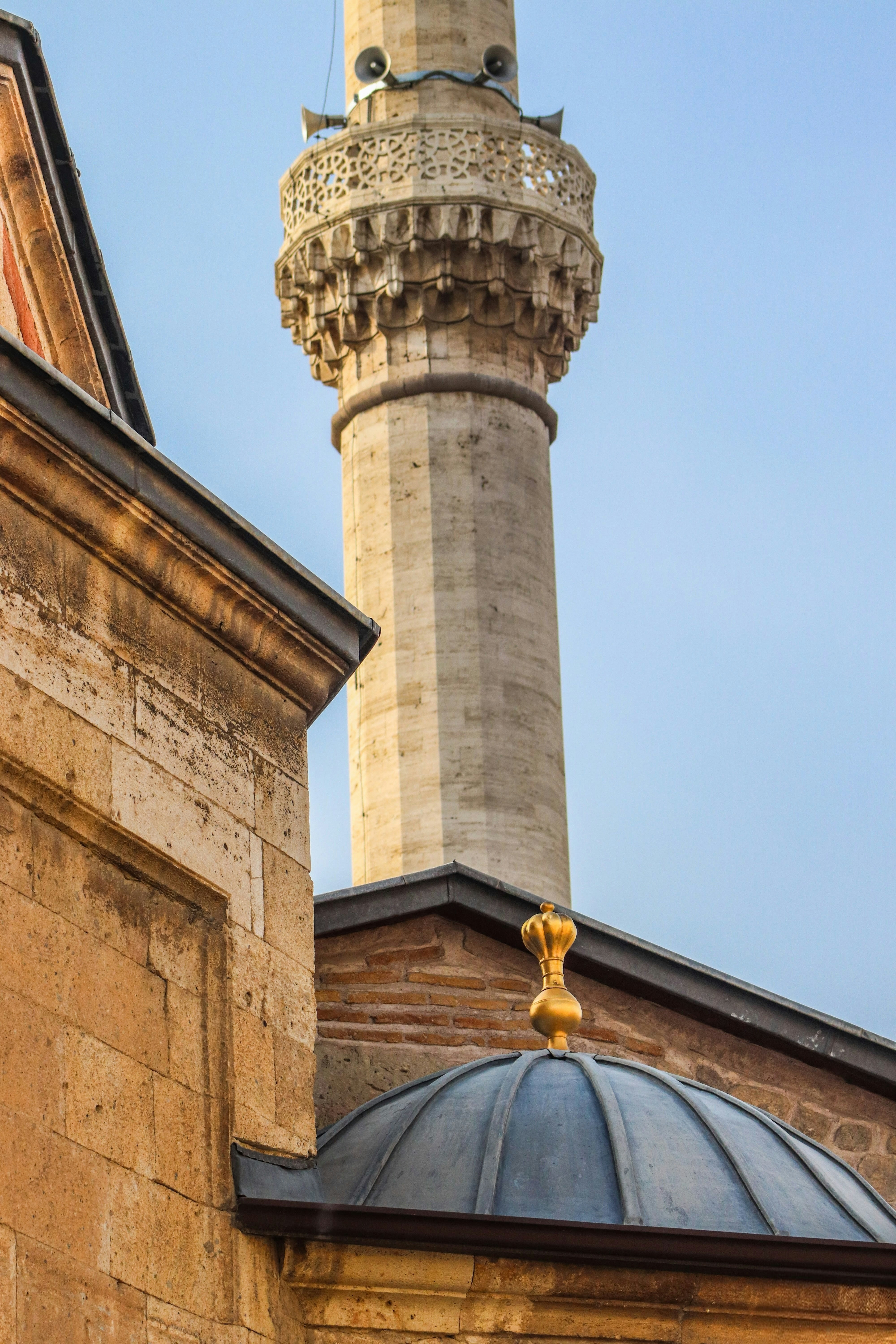 Minaret Tower Crest Over Brick Architecture