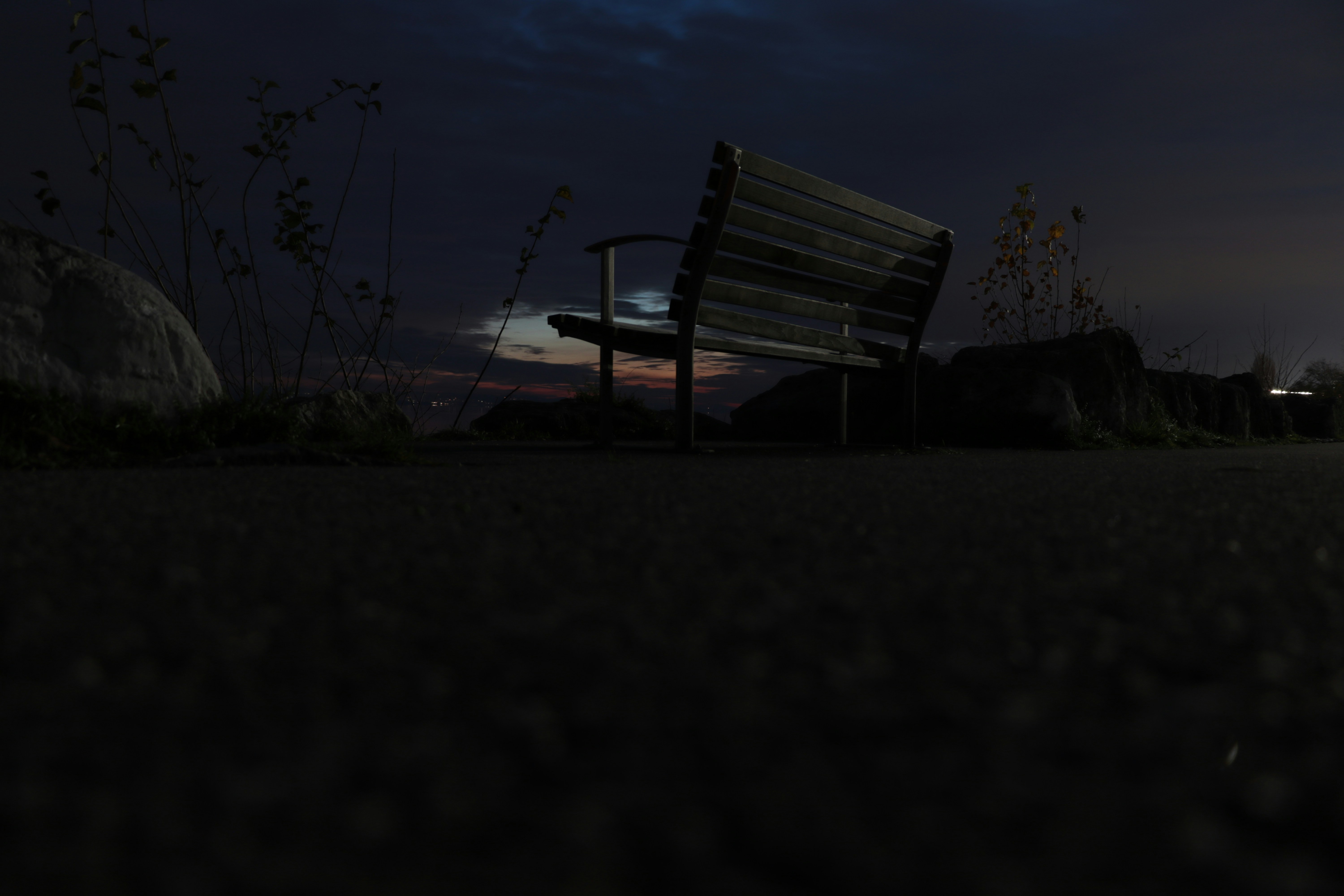 Lonely Bench at Dusk: A Quiet Pause by the Secluded Path