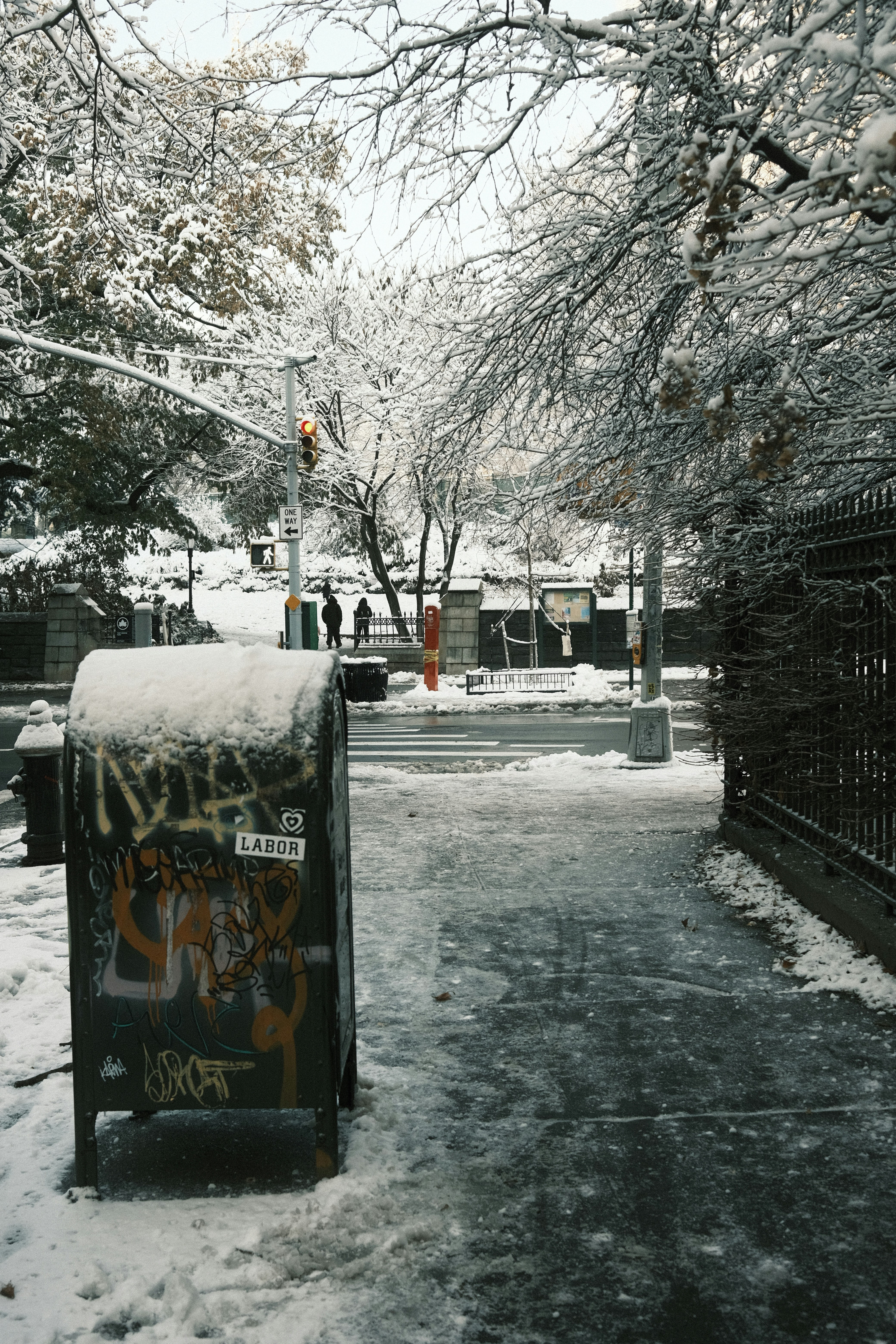 Snow-Covered Street Corner: A Quiet Winter Moment by the Mailbox