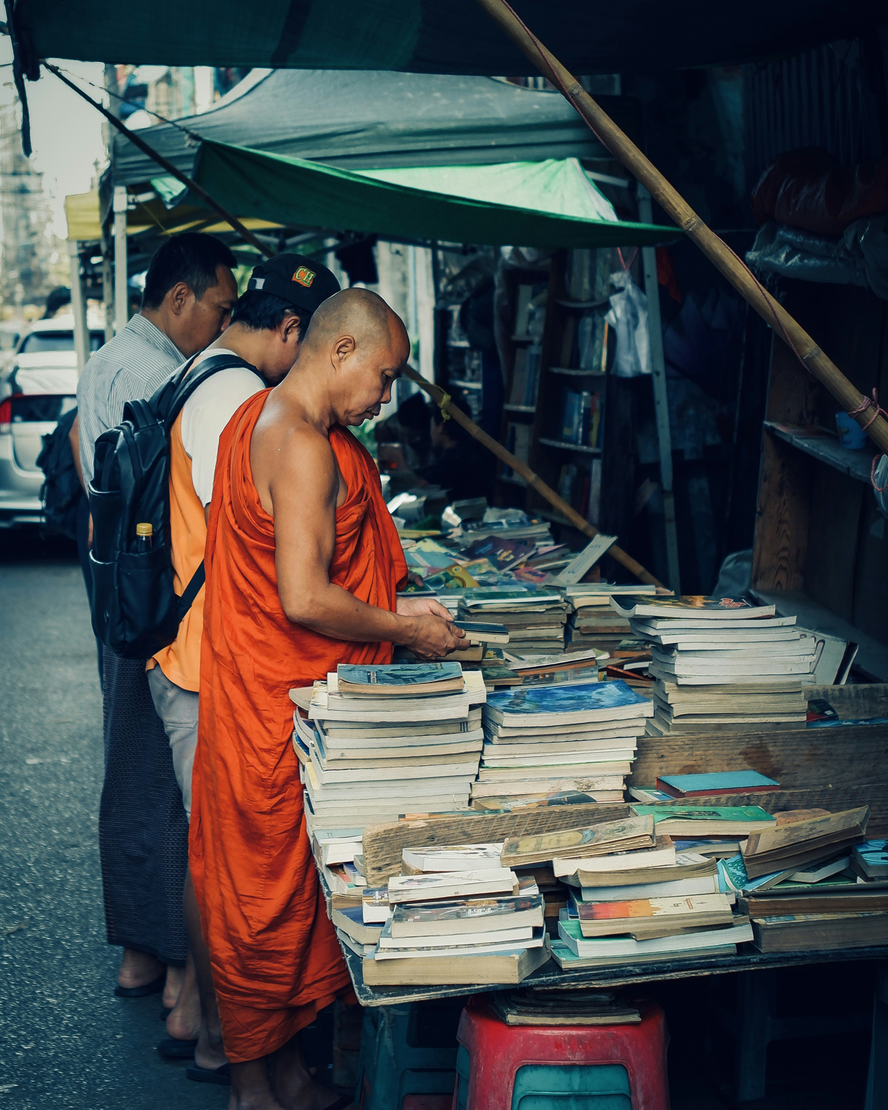 A monk's quiet focus among a mountain of stories