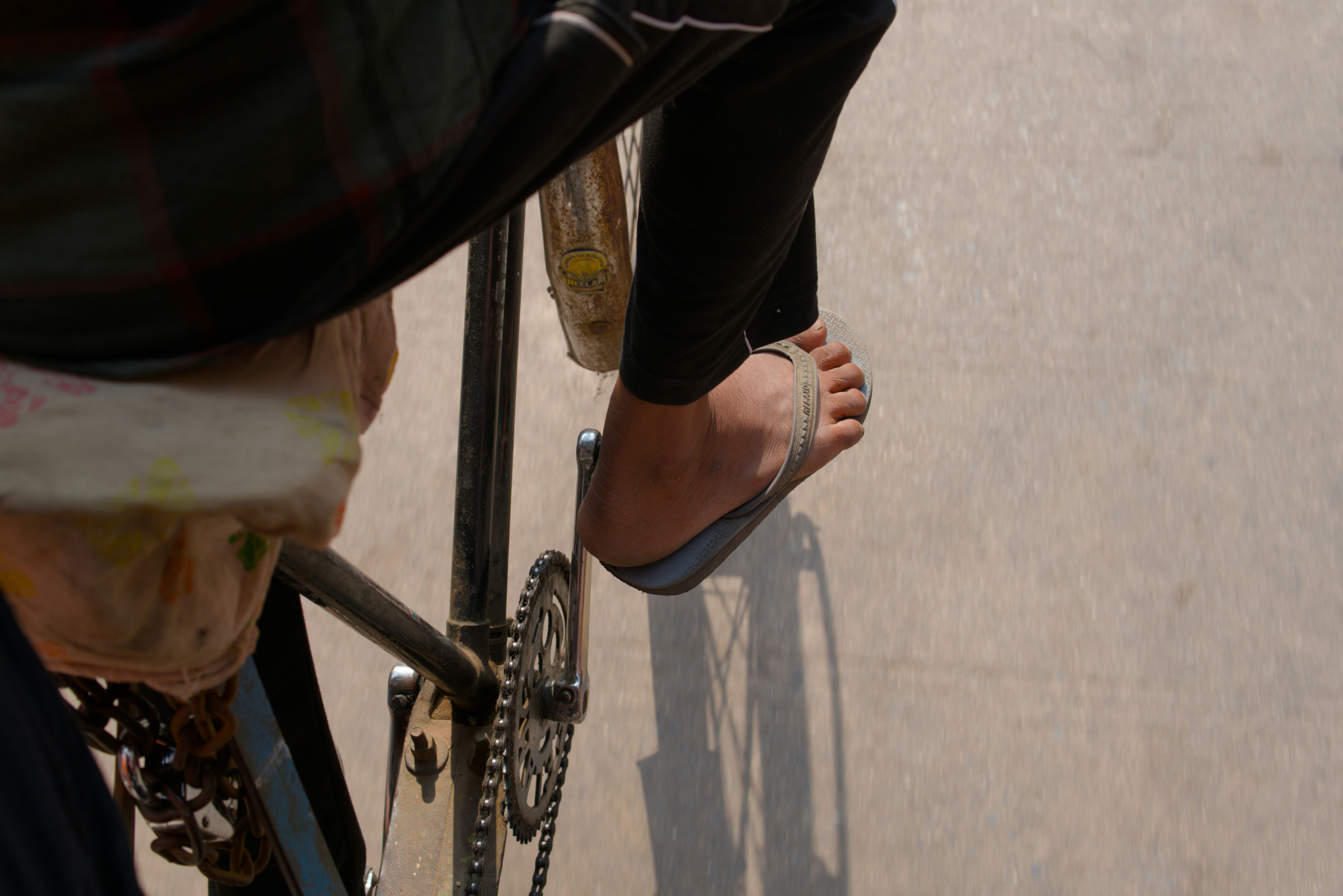 Pedal Path: Footwear and Bicycle Chain in Motion