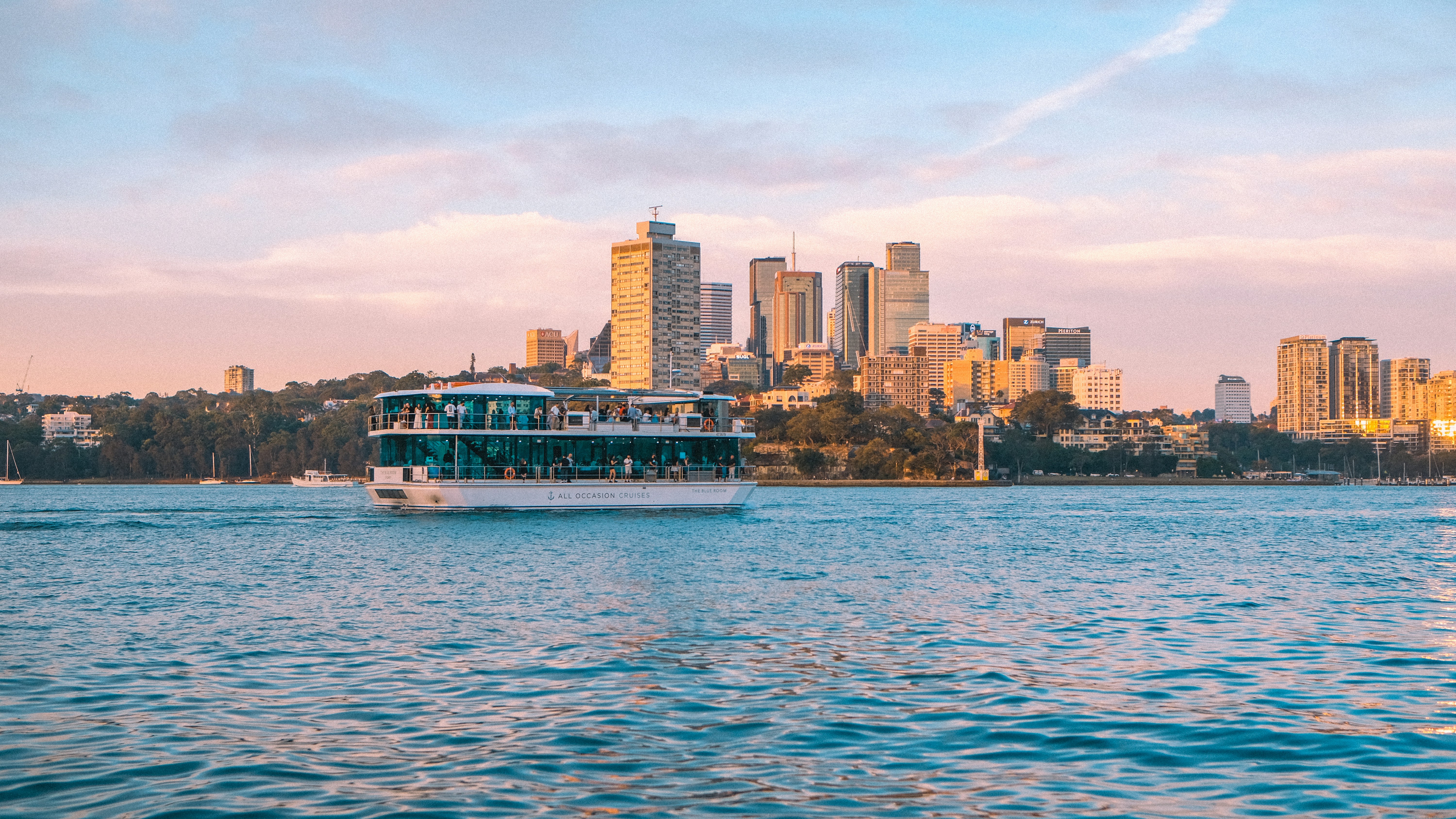 Urban Waters: City Skyline and Ferry Gliding Across Harborside