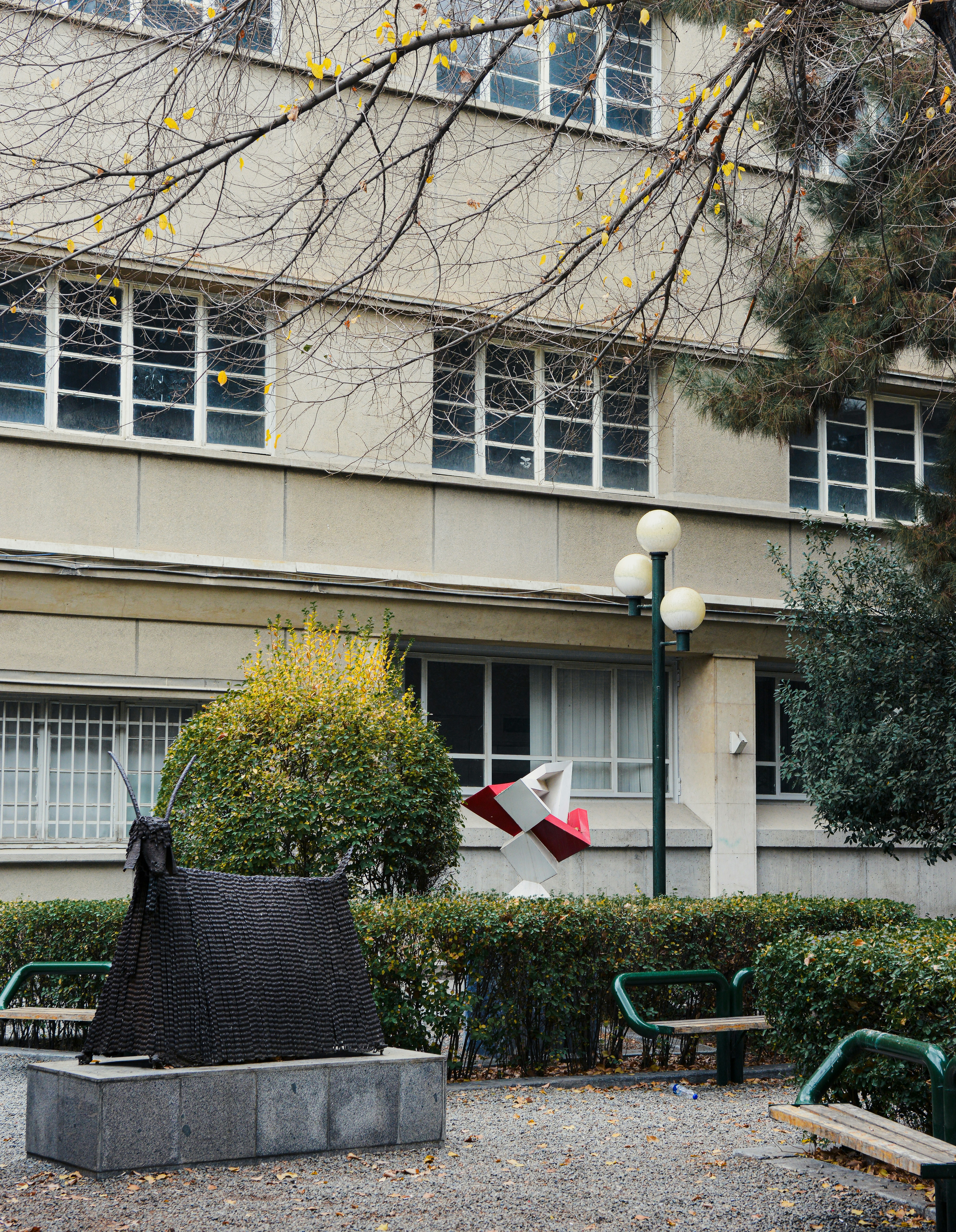 Urban Courtyard Sculpture Amidst Modernist Facade