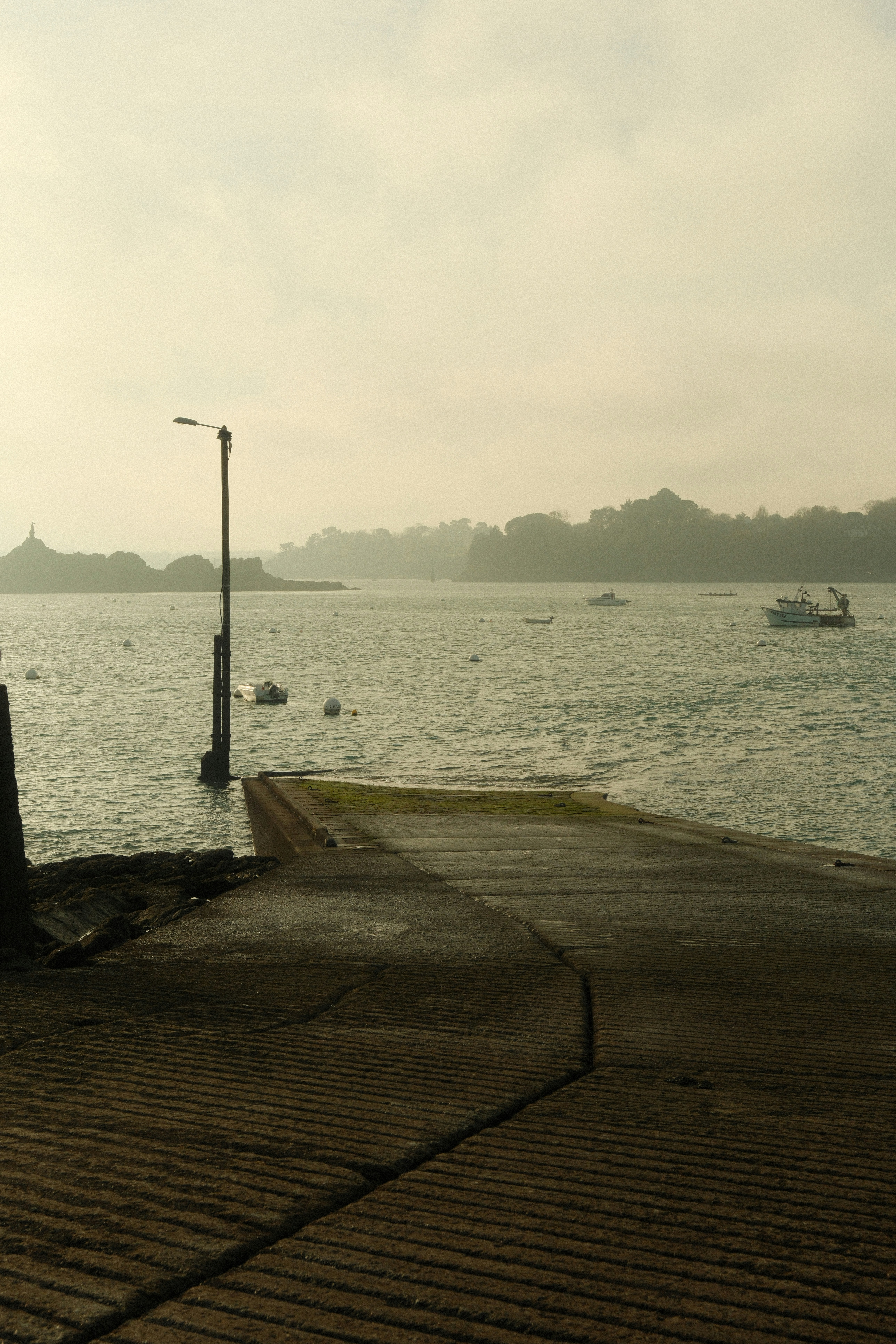 Quiet Pier at Dusk: A Seascape in Soft Sepia Tones
