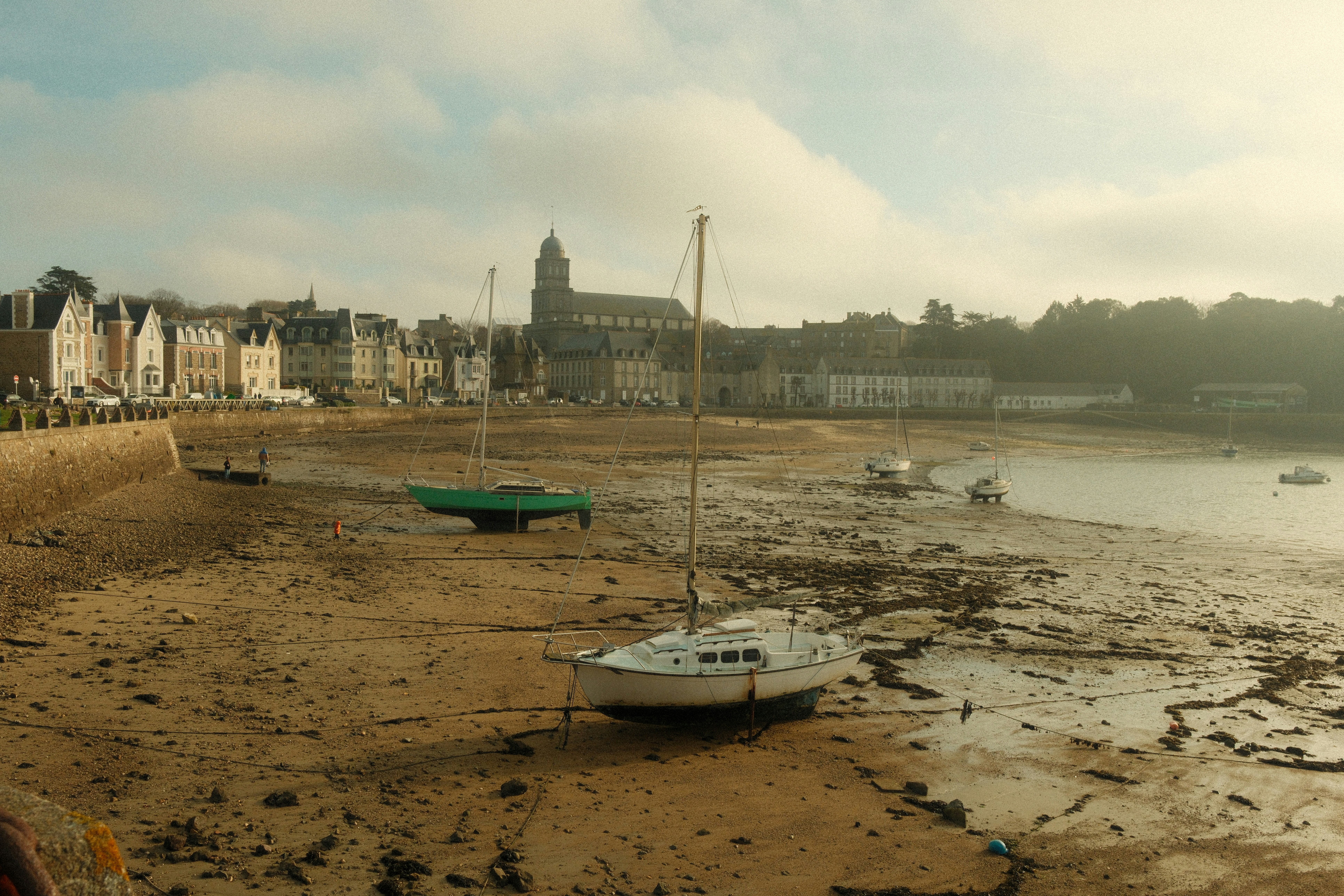 Harbor in Calm Light: Boats Rest on a Tide-smoothed Shorefront