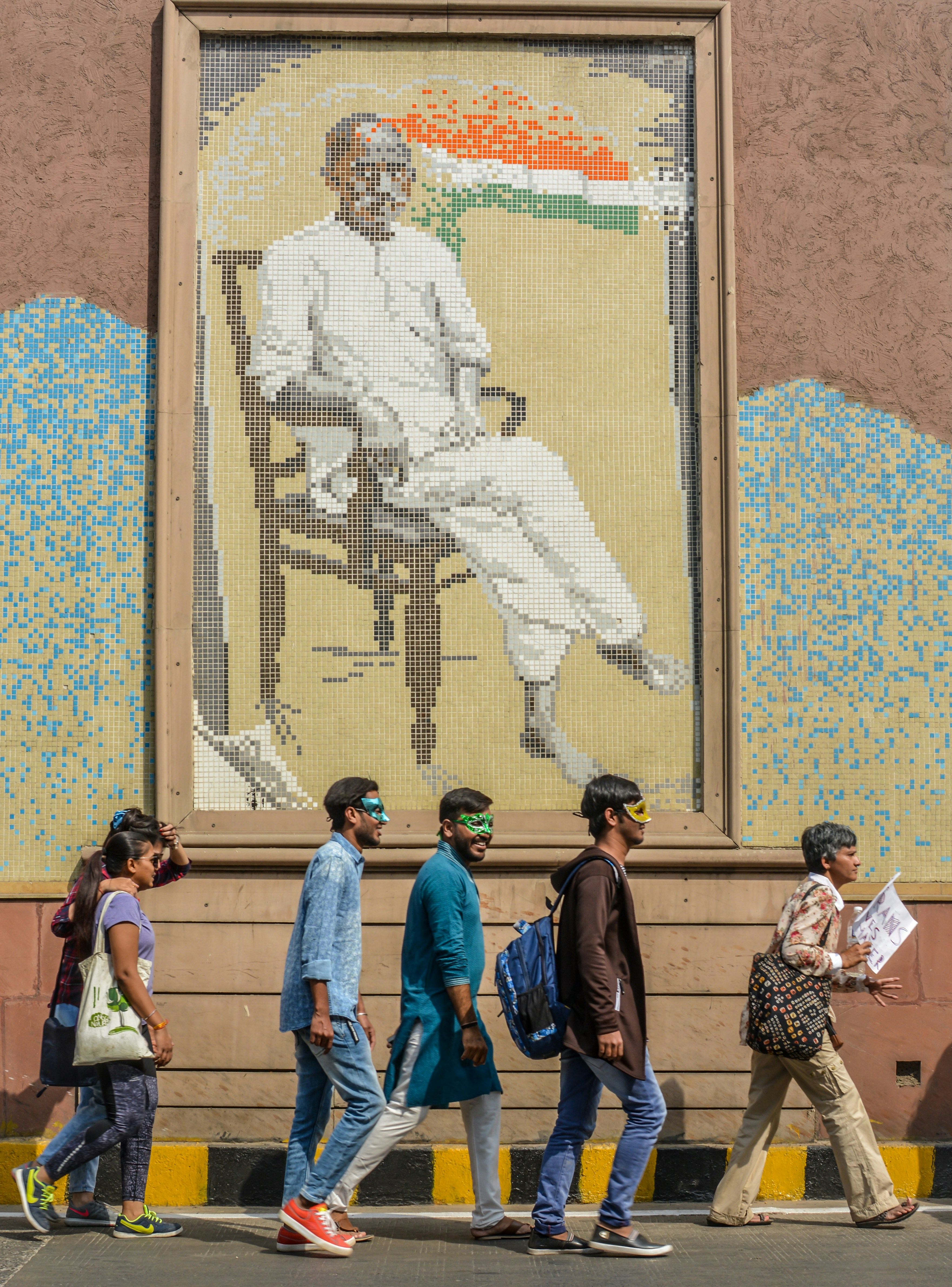 Faces in Transit: A Walk Past a Muraled Magistrate