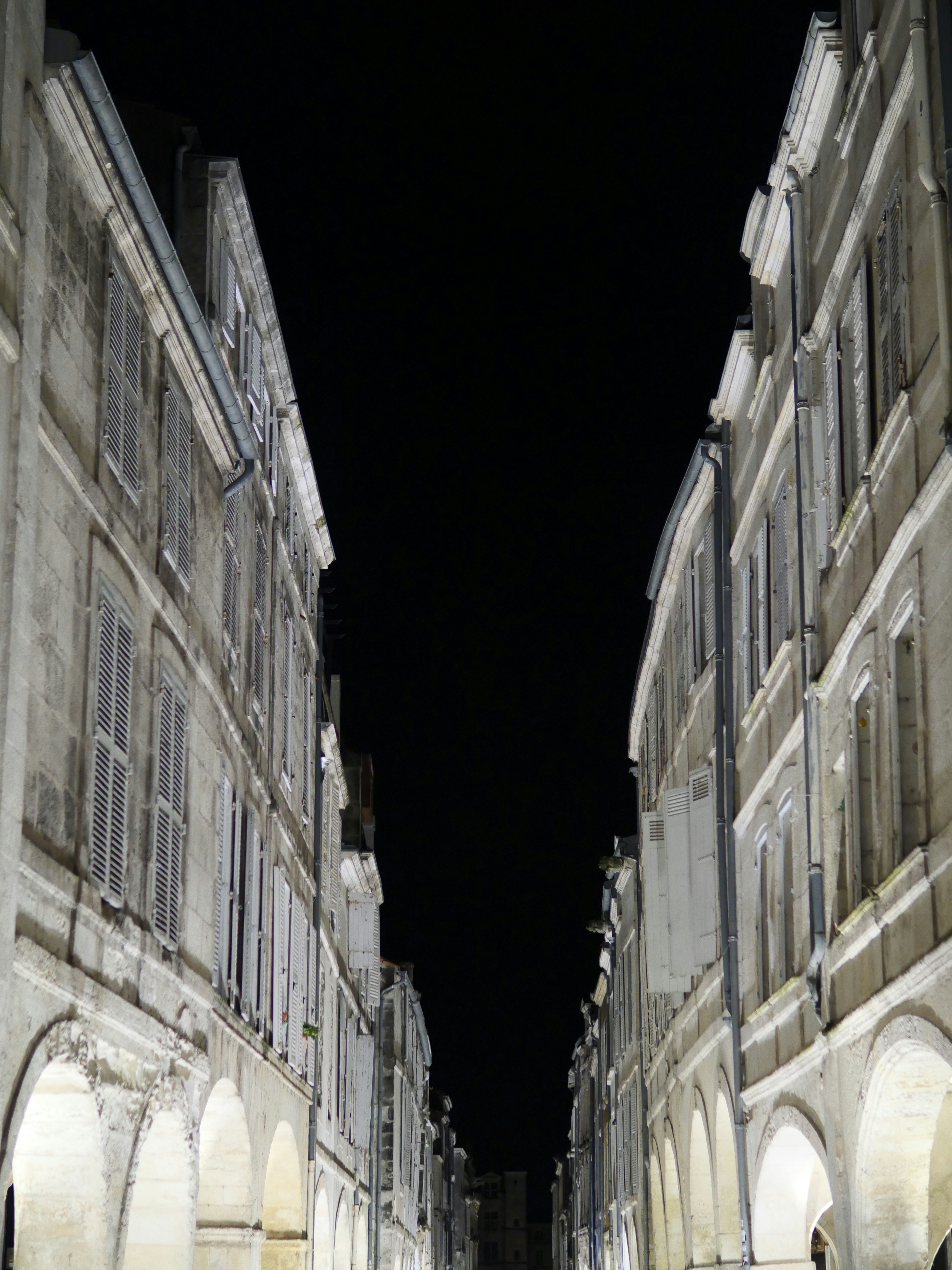 Moonlit Archways: A Narrow Street Where History Breathes