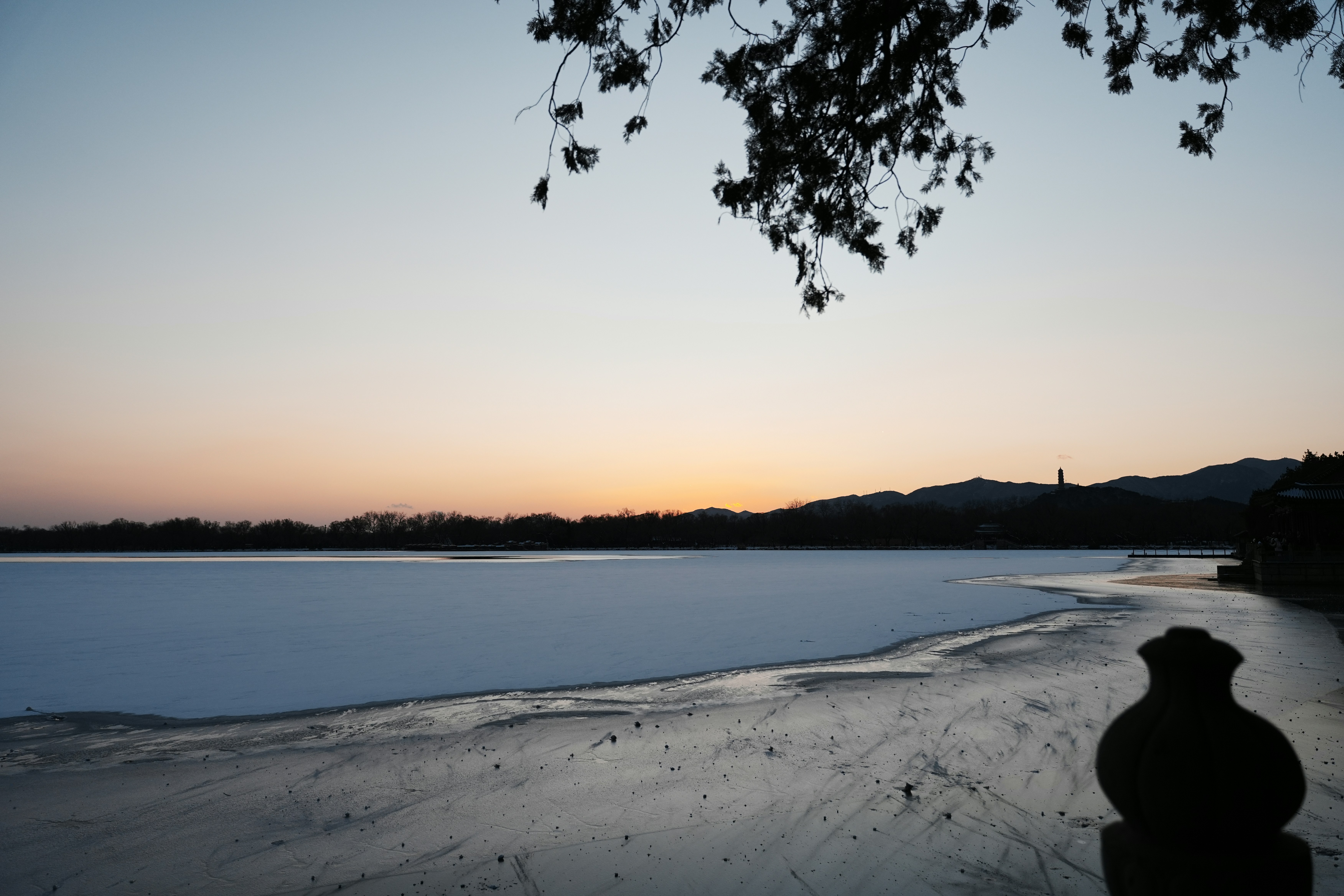 Twilight Shoreline: Dusk Over Ice and Shadow