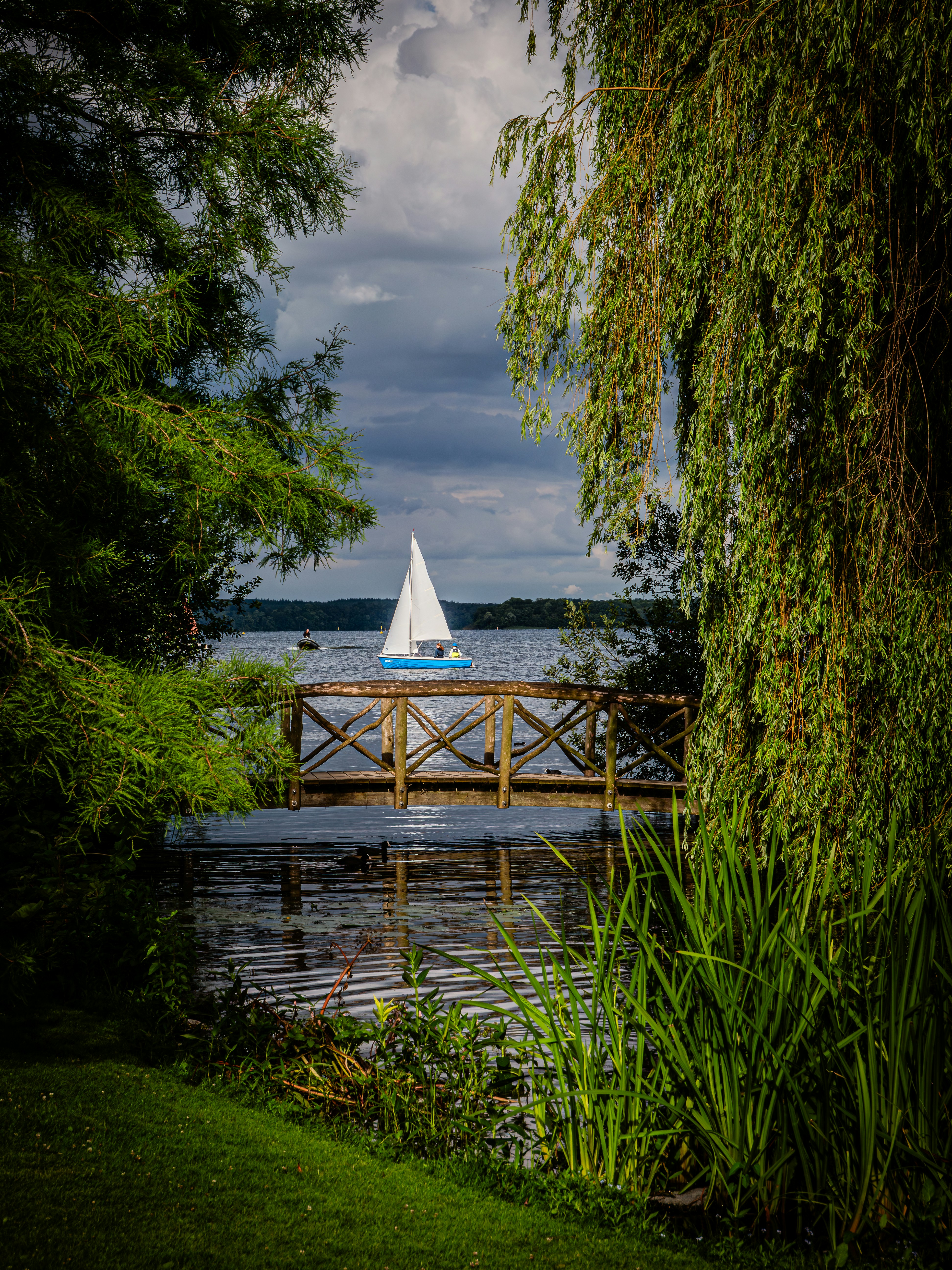 a sailing boat on a lake in northern Germany on a cloudy day