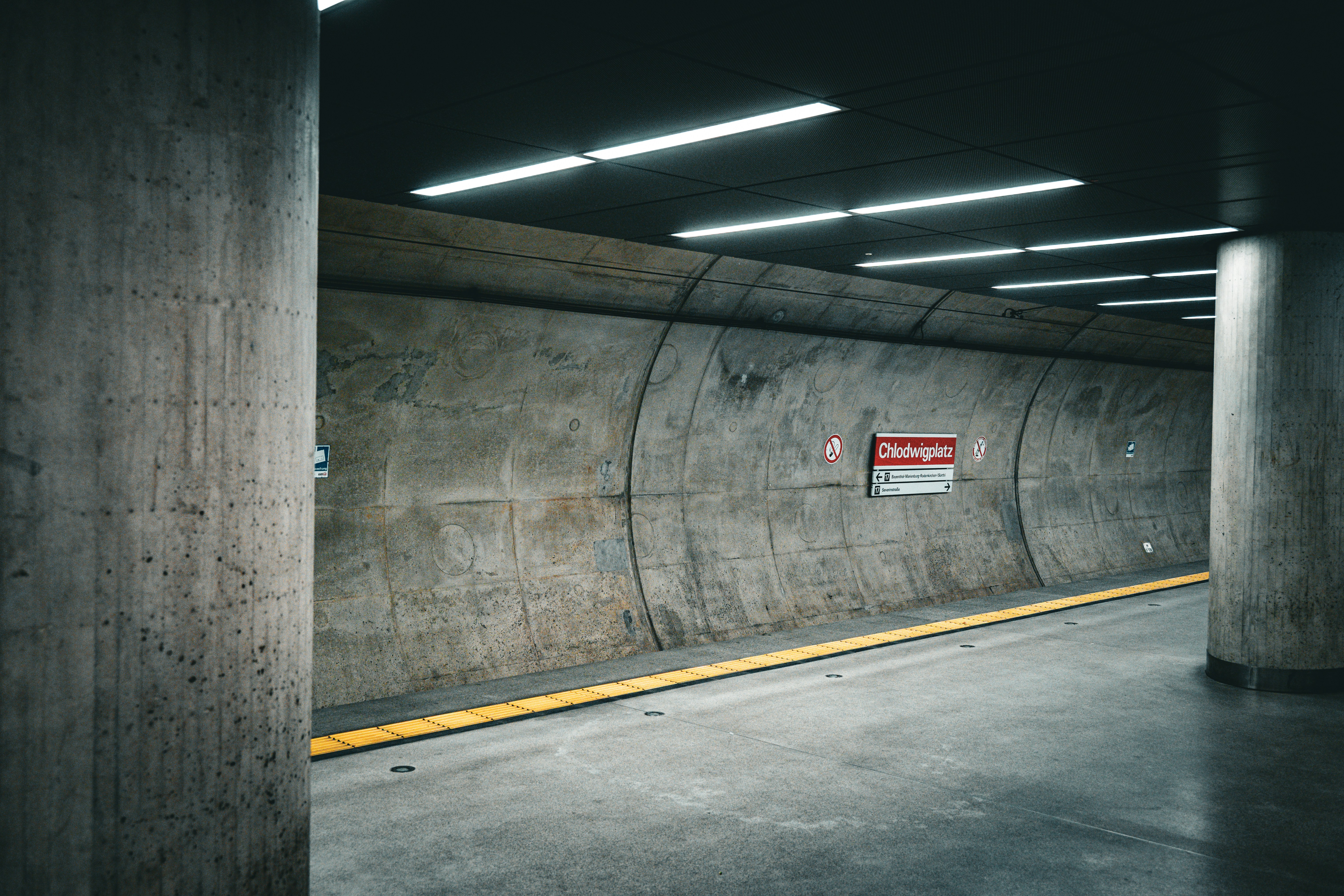 Concrete subway station with yellow line and lights photo – Free Travel ...