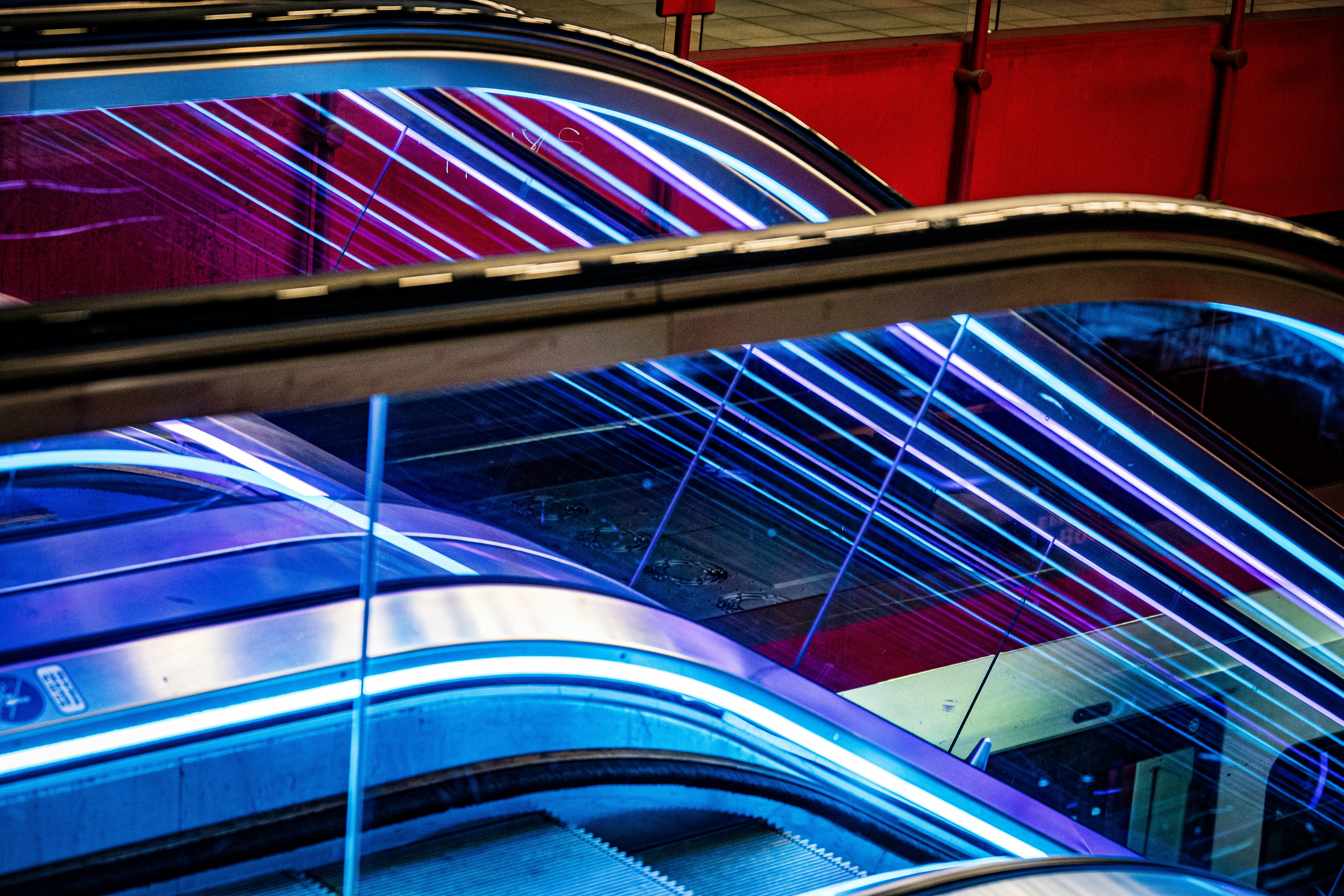 Neon Veins of the Escalator