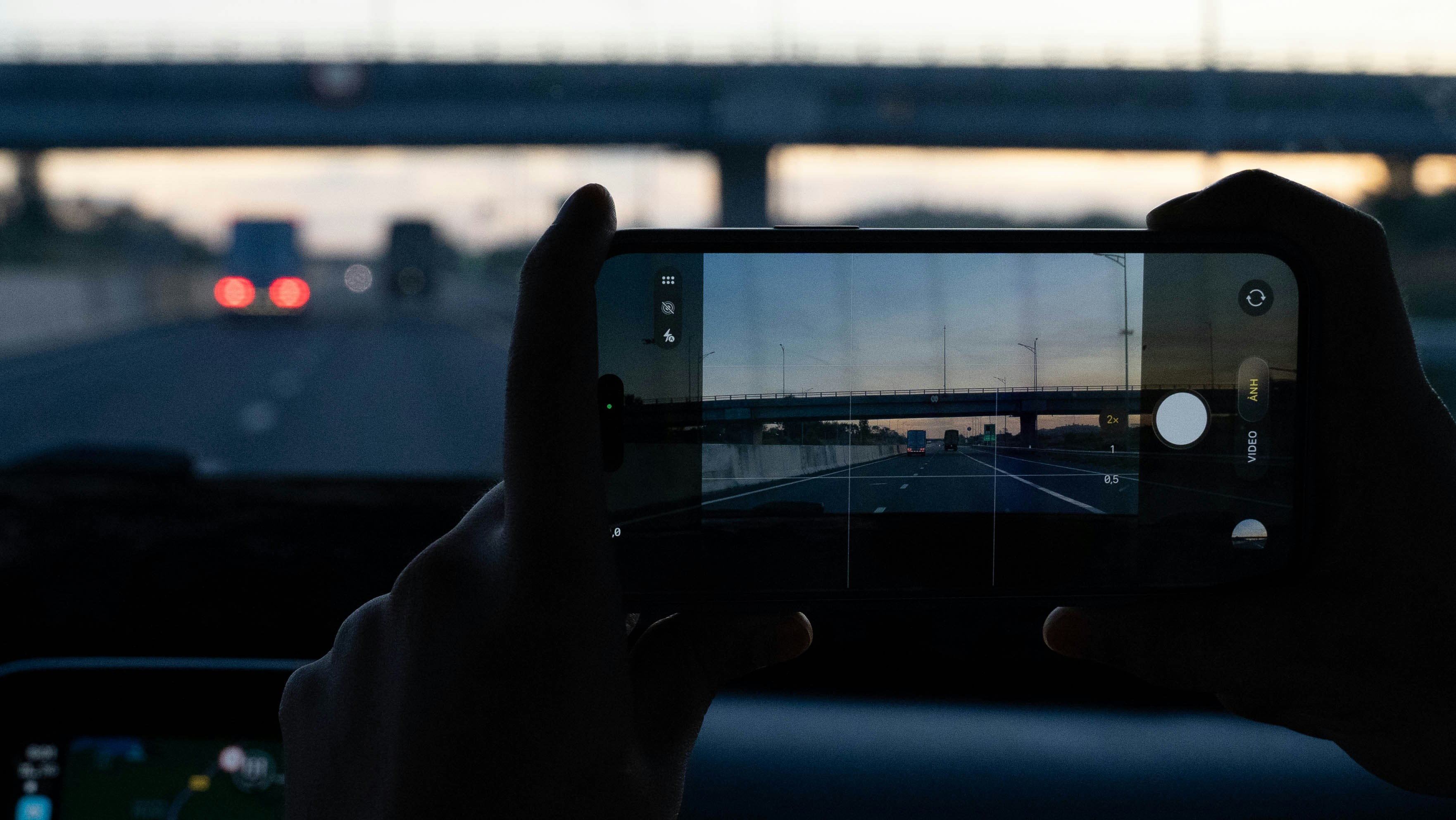 Through the Phone Screen: Highway Horizon in Focus