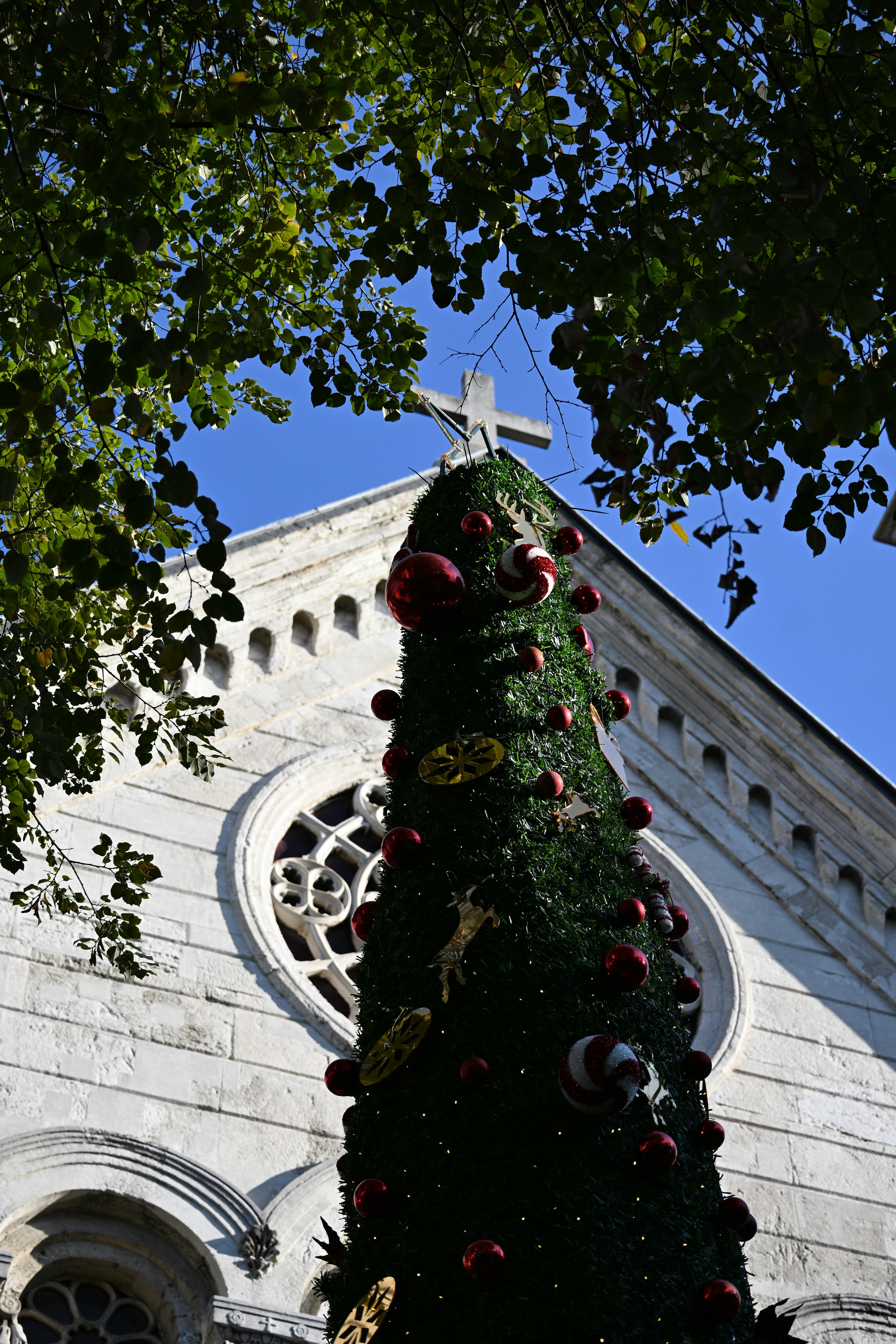 Christmas Tree Adorned Chapel Reaches Toward a Clear Blue Sky