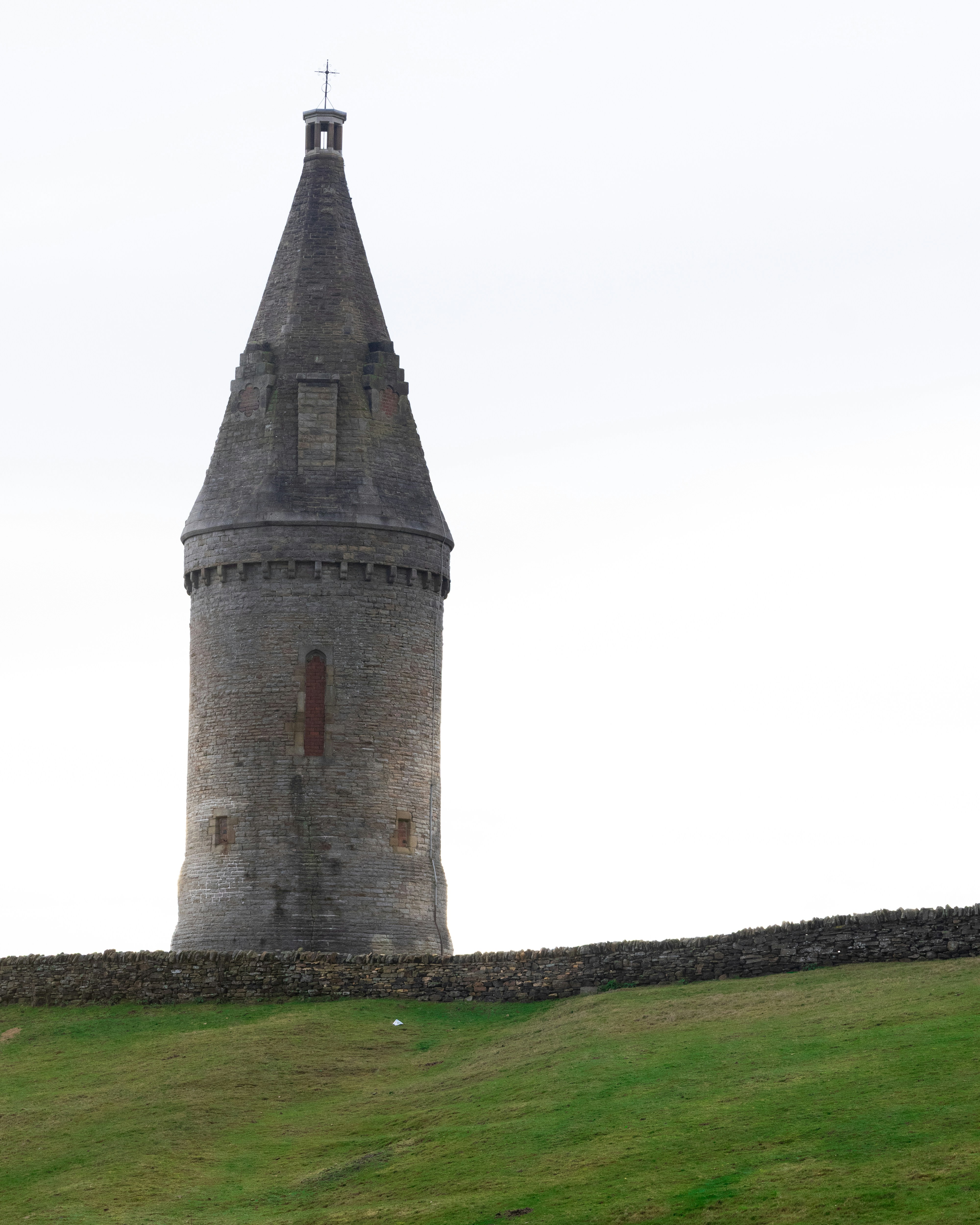 Hartshead Pike Tower in Ashton near Greater Manchester. A picturesuqe location for sunsets and Manchester city skylines.