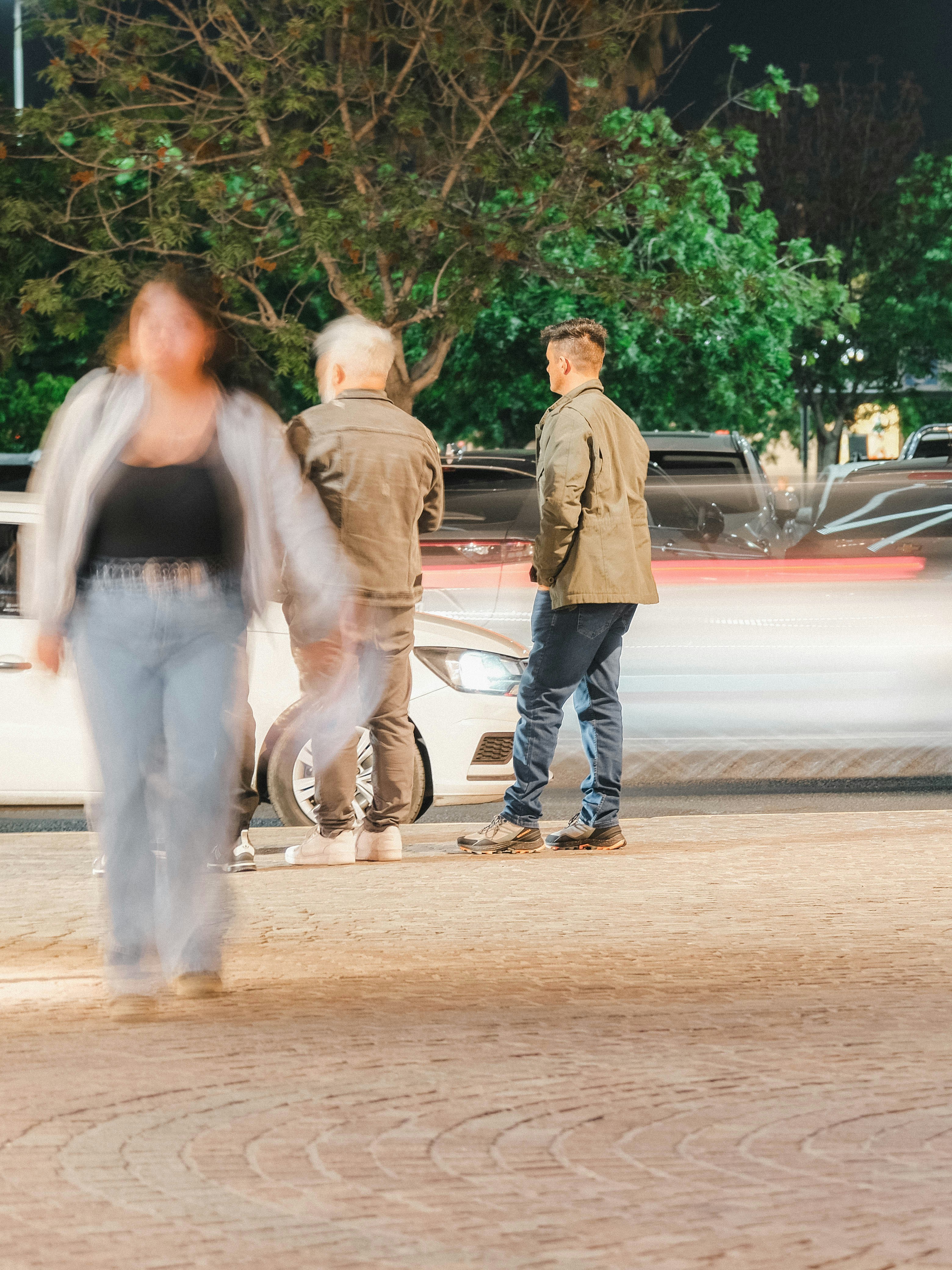 Nighttime Pedestrian Crossing: A Blur of Motion by the Carline