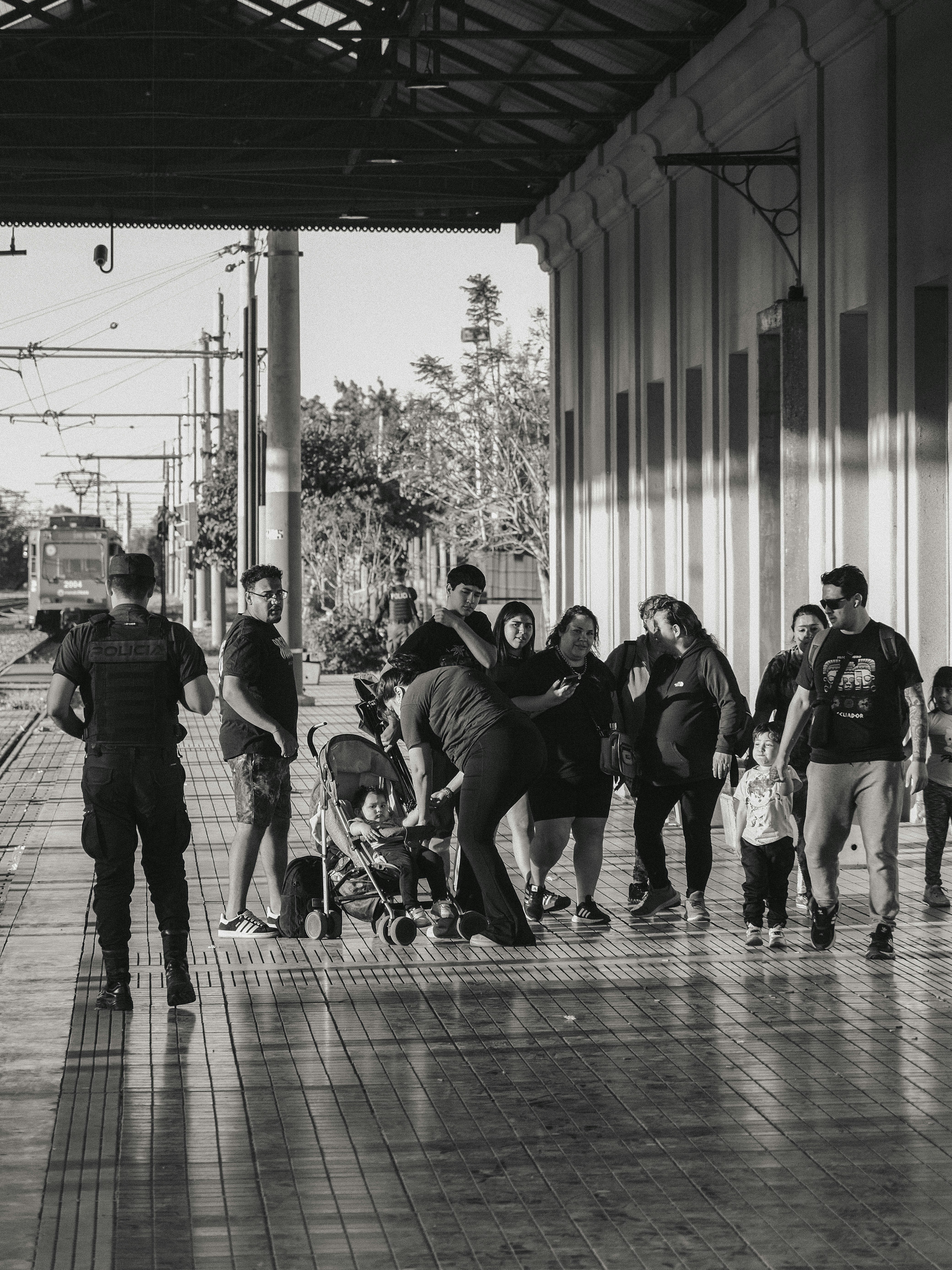 Gathered at the Platform: A Quiet Moment Beneath the Station Steel