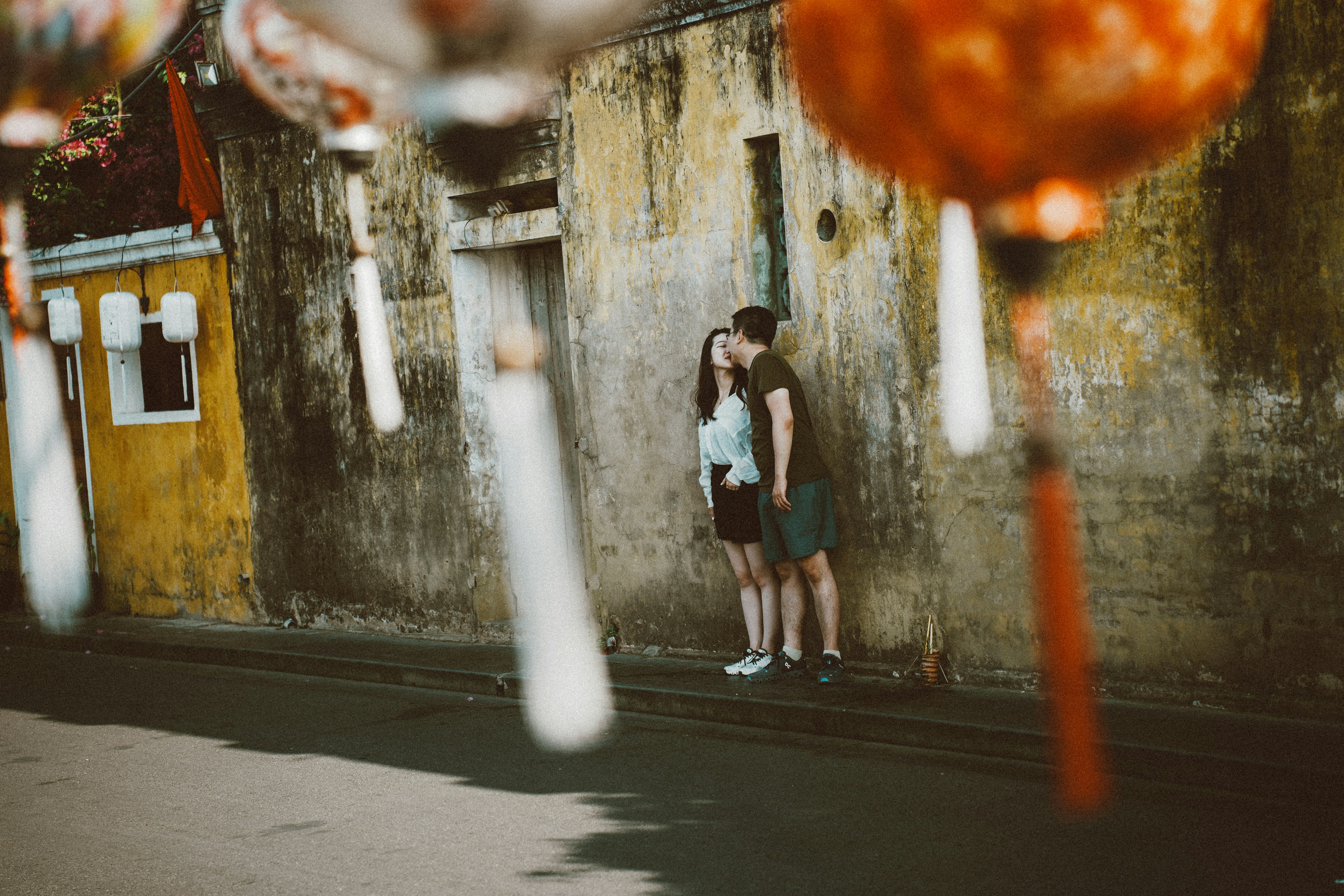 Kiss in the Quiet Alley under Lanterns