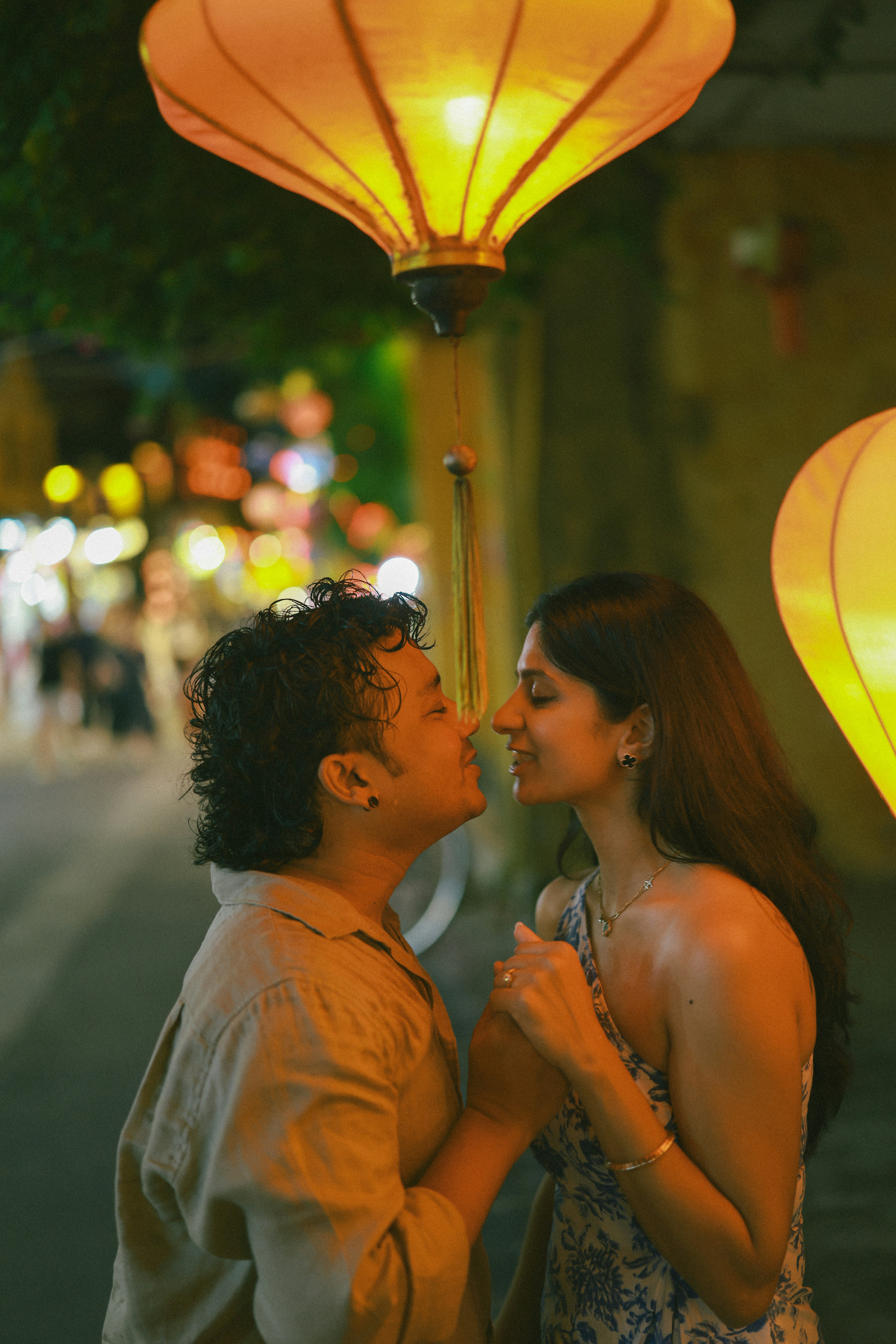 Whispered Goodbye under Lantern Glow
