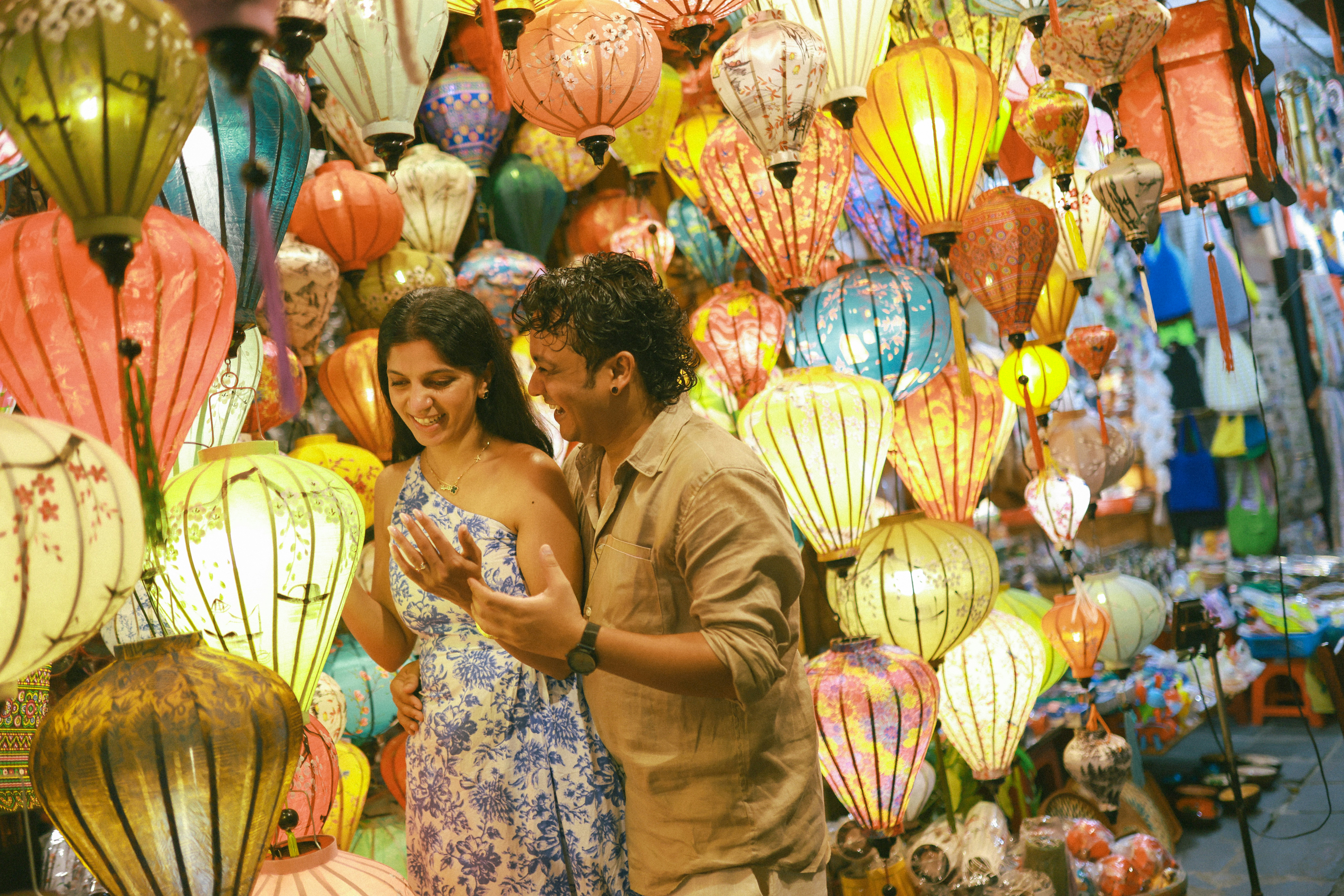 Lantern-lit Moment: A Couple Among Colorful Orbs