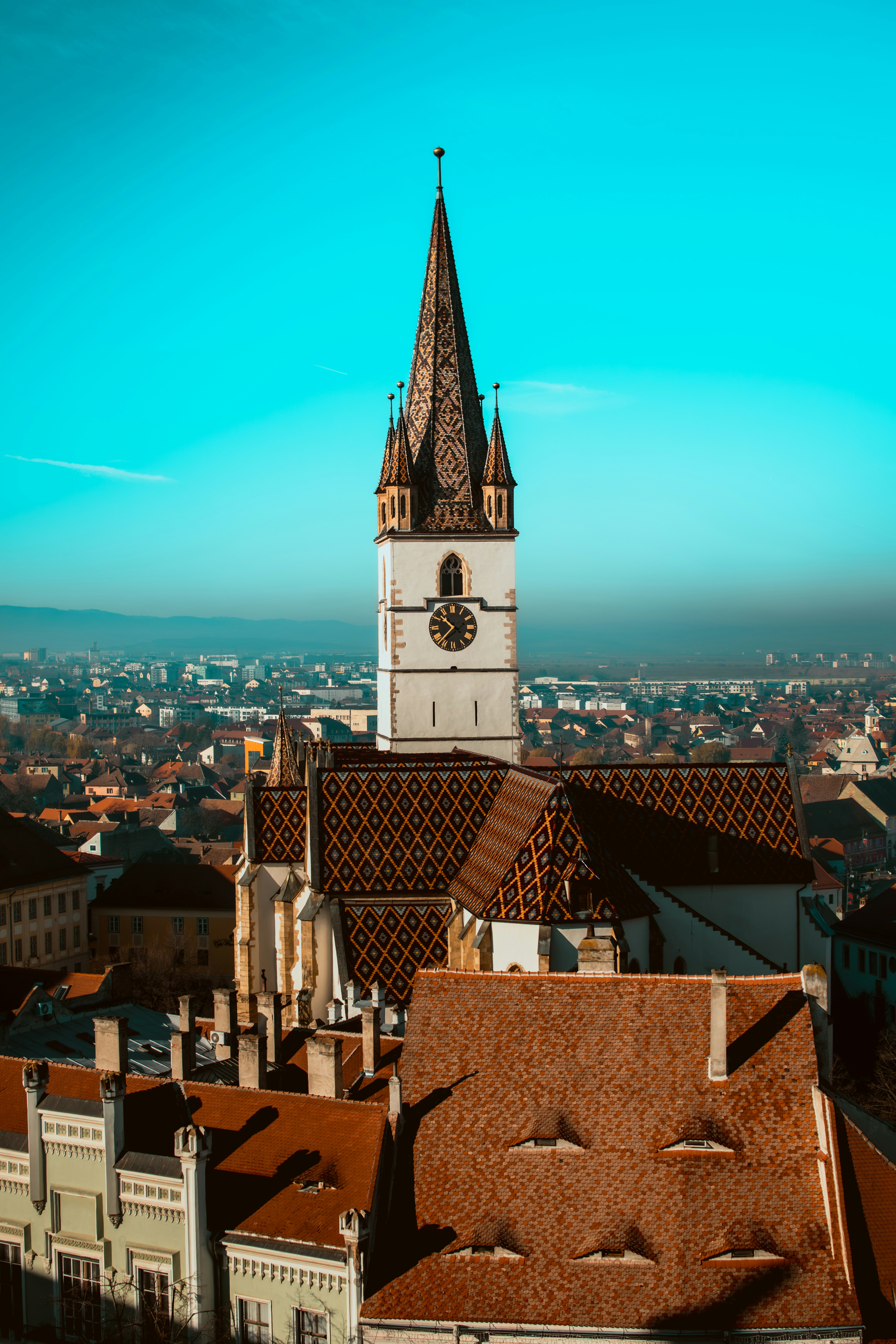 Cathedral Spire Rising Above a Sunlit Old Town