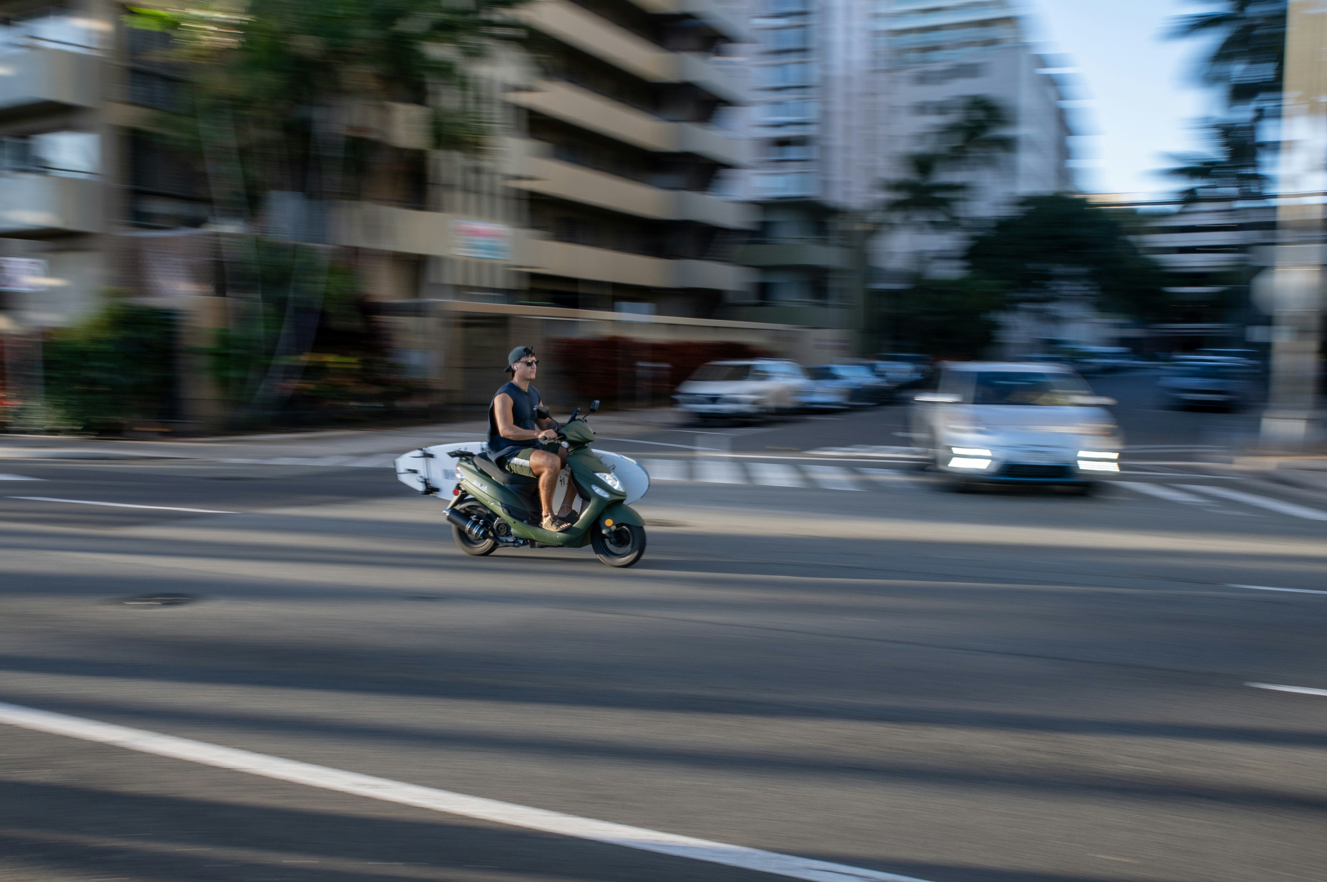 Rider in Motion: A City Street Snapshot on a Blurred Rush