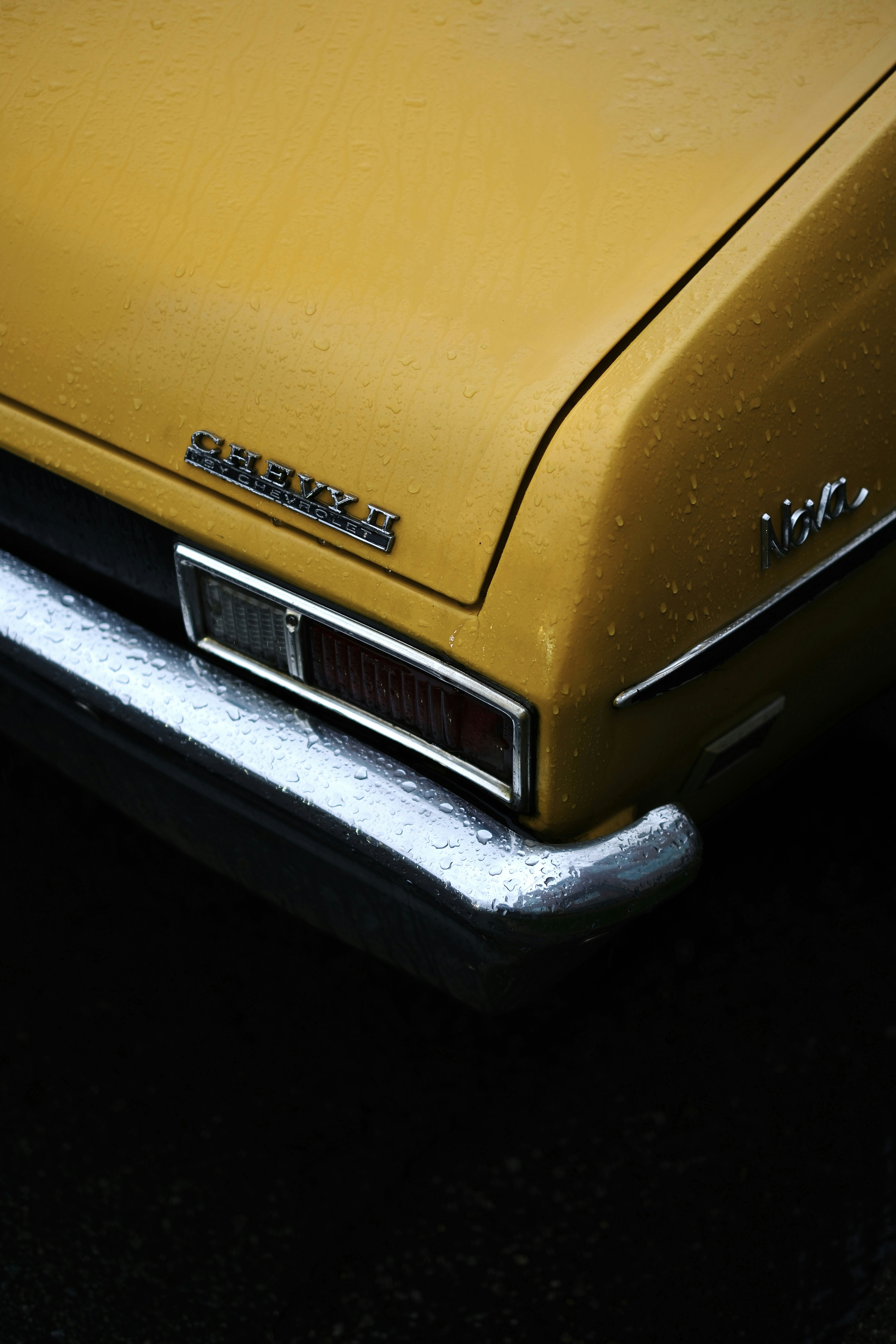 Yellow Vintage Suzuki: Rain-Kissed Curves and Chrome