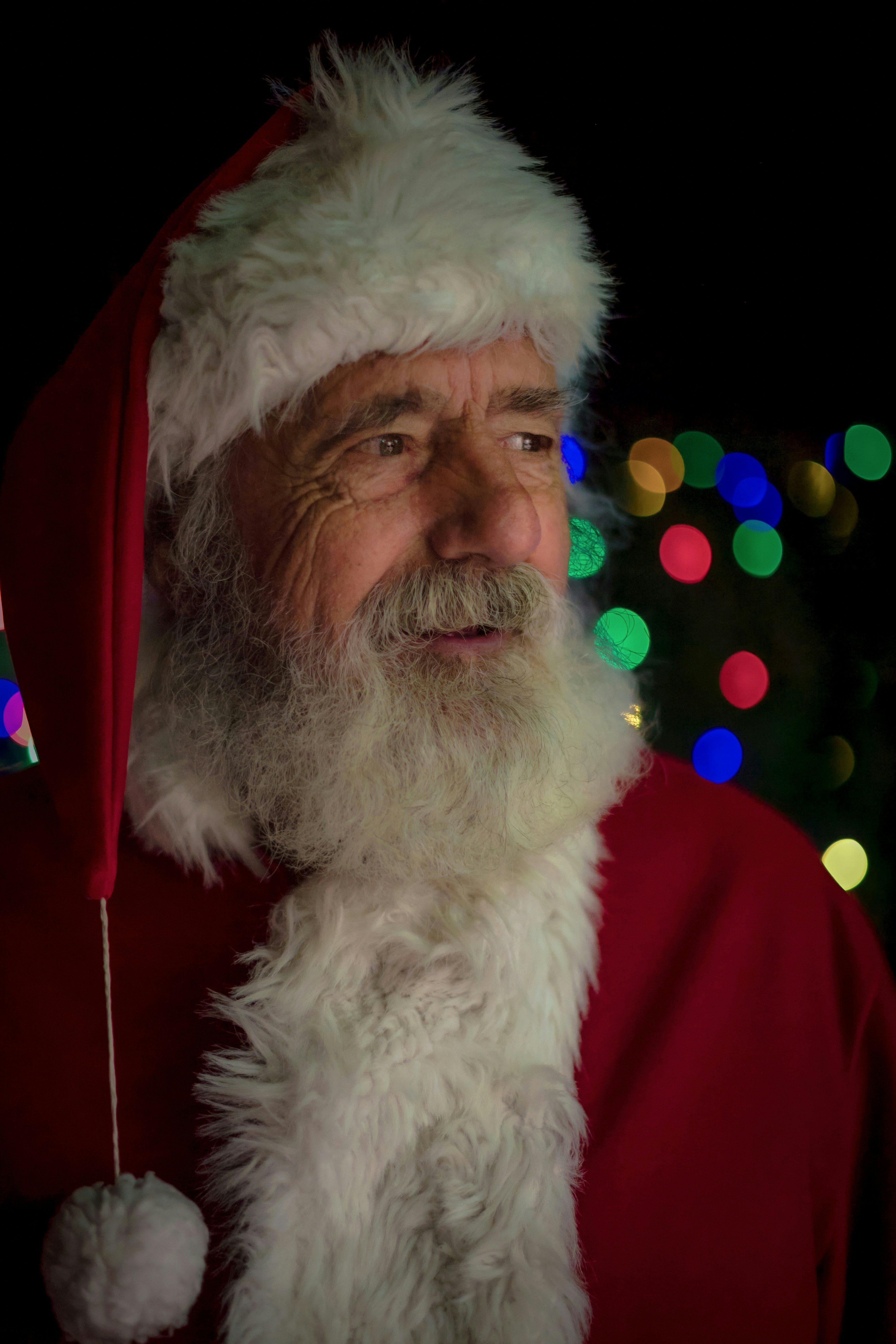 Santa in Soft Focus Under Neon Holiday Lights