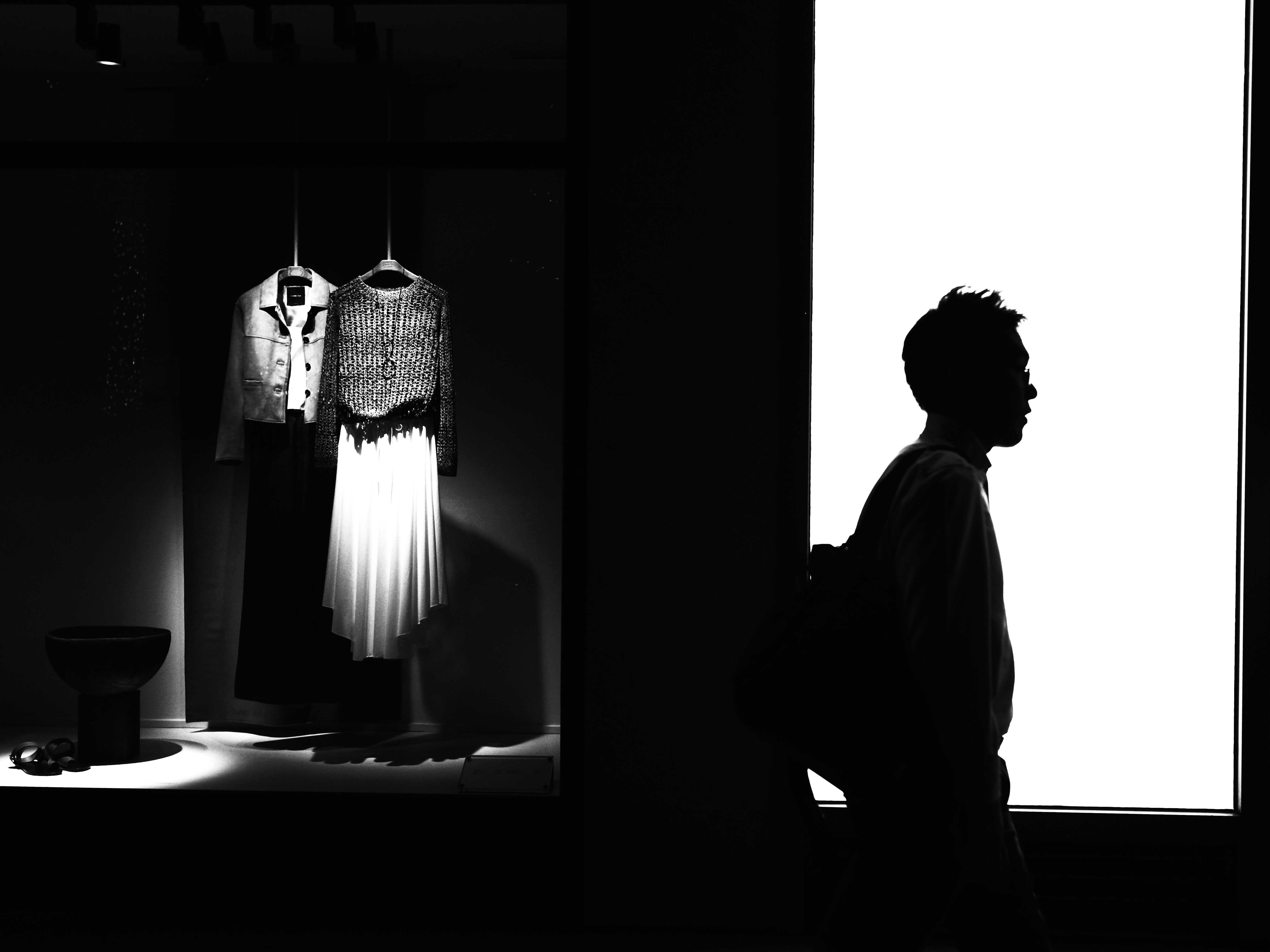 Silhouette and Shop Window: A Quiet Contrast of Light