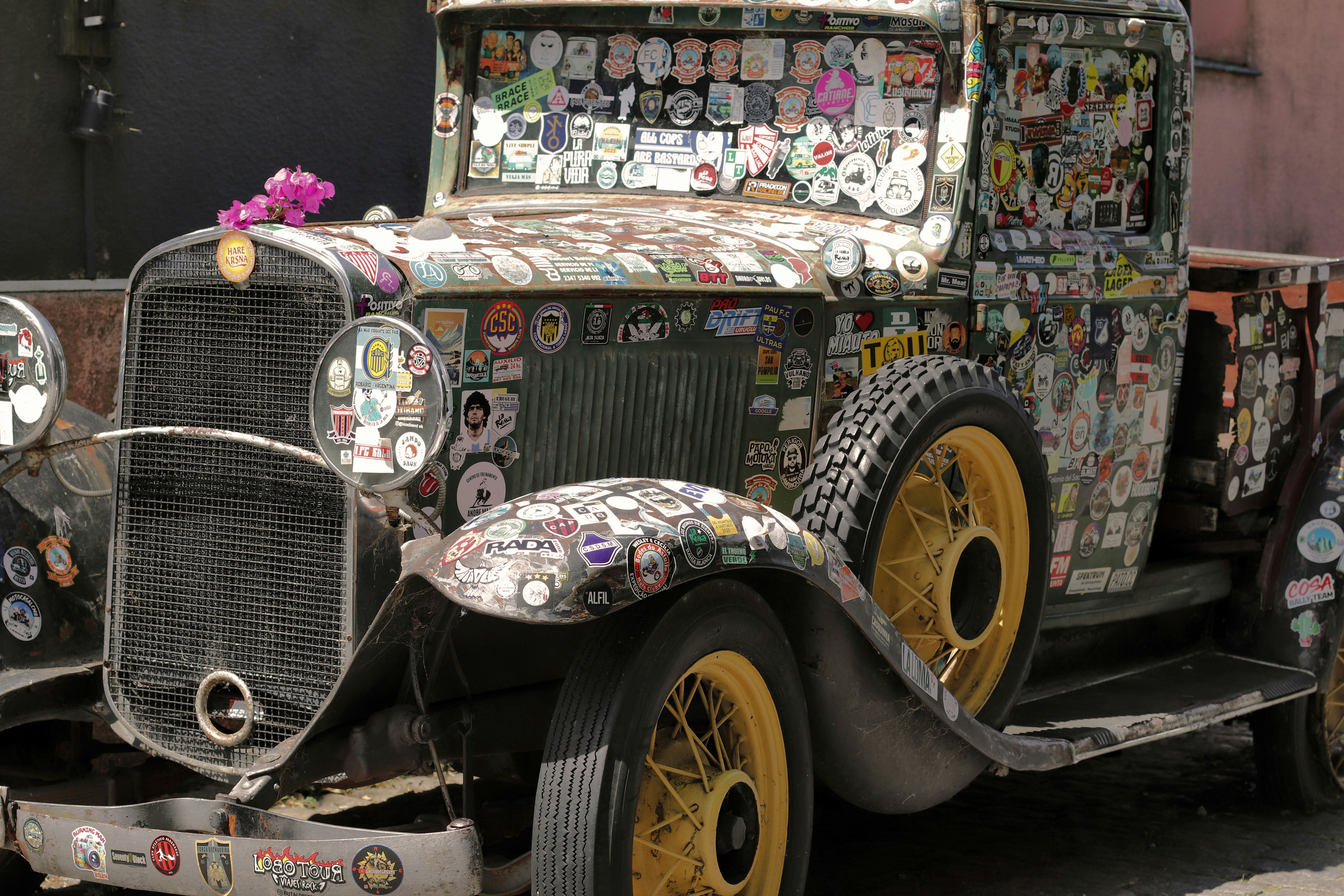 Stickers and Steam: A Vintage Car's Colorful Chronicle