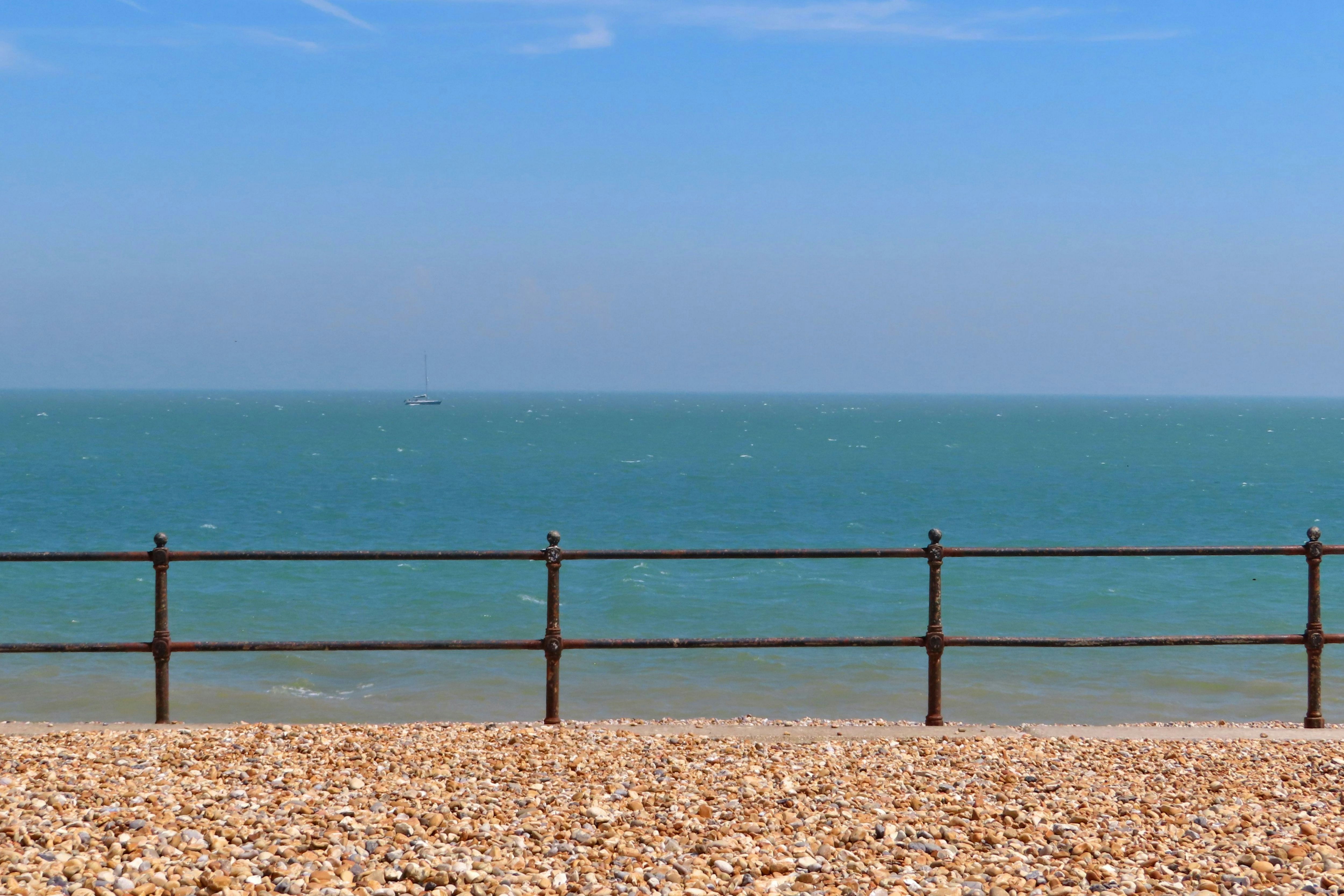 Railings on the beach, looking across the English Channel