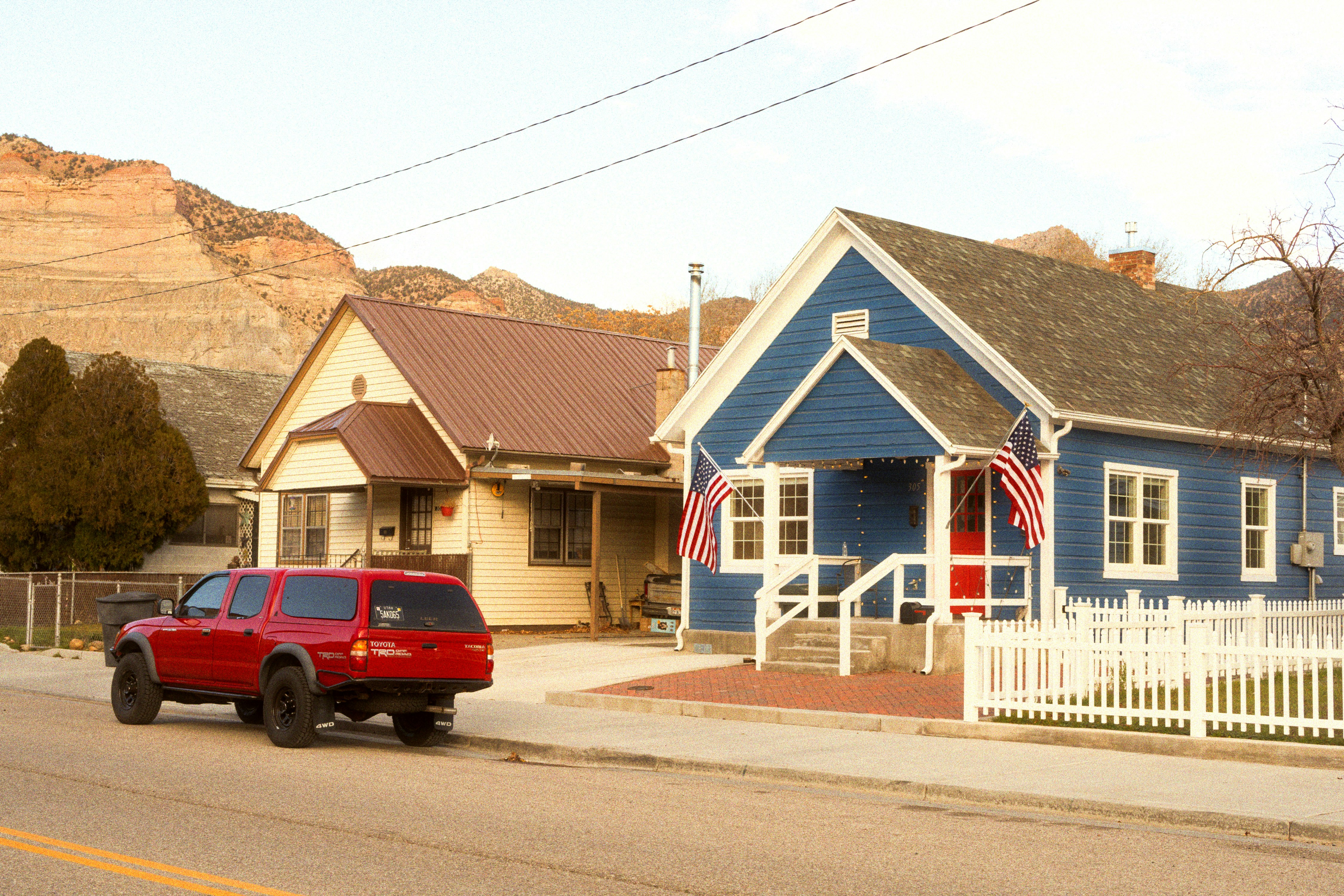 Red Truck, Blue House, and a Quiet Main Street
